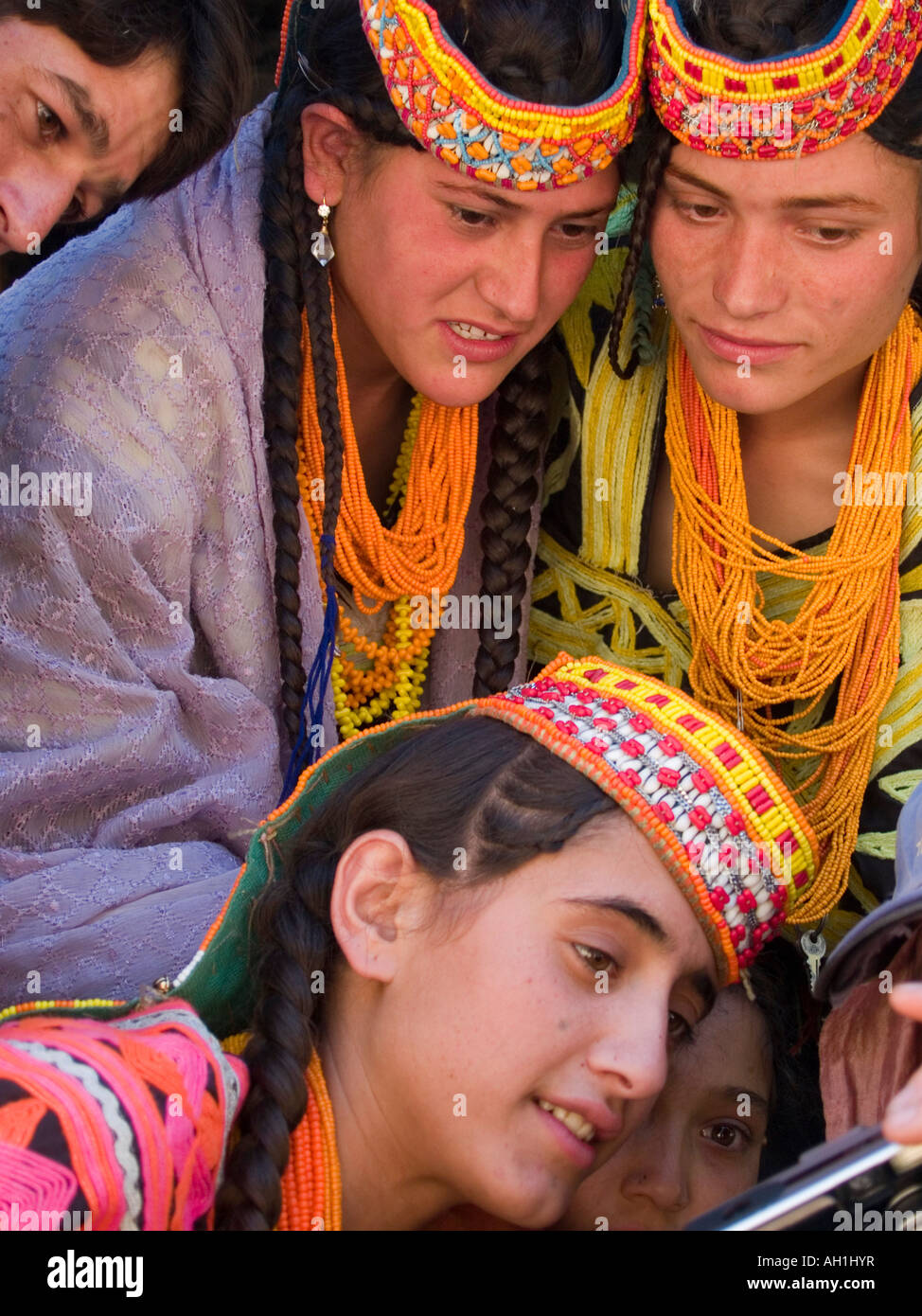 Kalasha women viewing their digital photos Stock Photo - Alamy