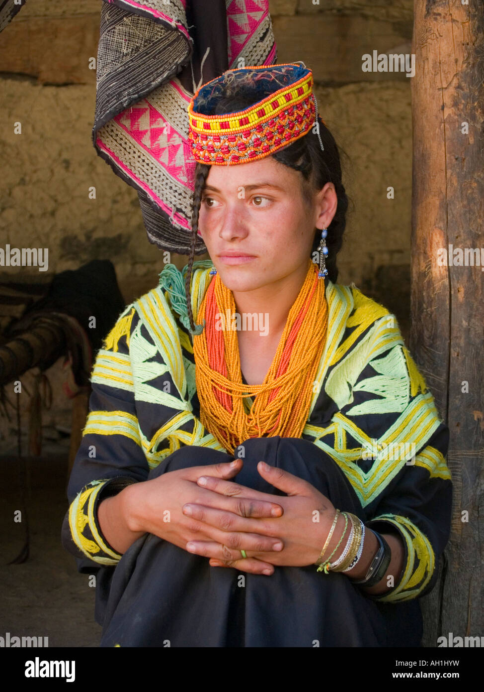 Kalasha woman sitting outside her home Stock Photo - Alamy
