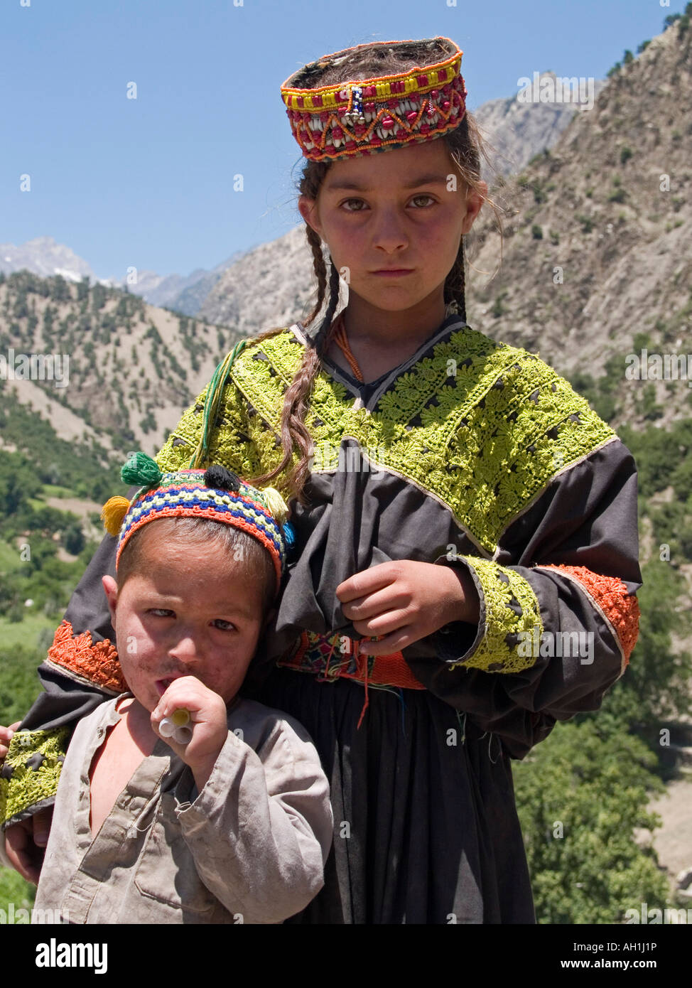 A Kalasha girl and her brother posing in the Rumbur Valley Chitral ...
