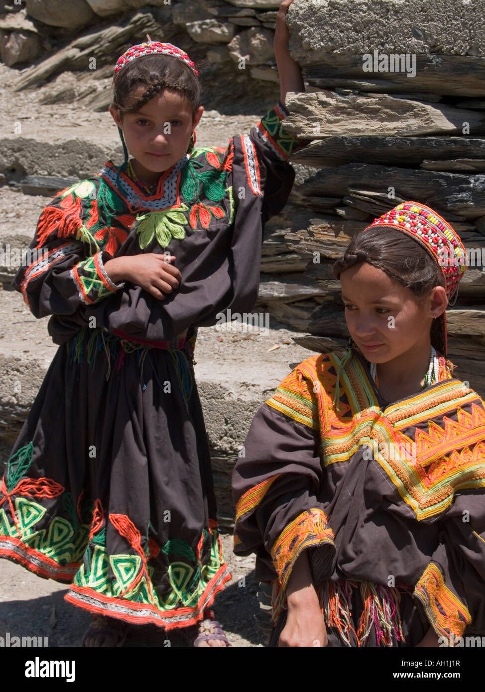 Smiling Kalasha girls sitting in the Rumbur Valley, Pakistan Stock ...