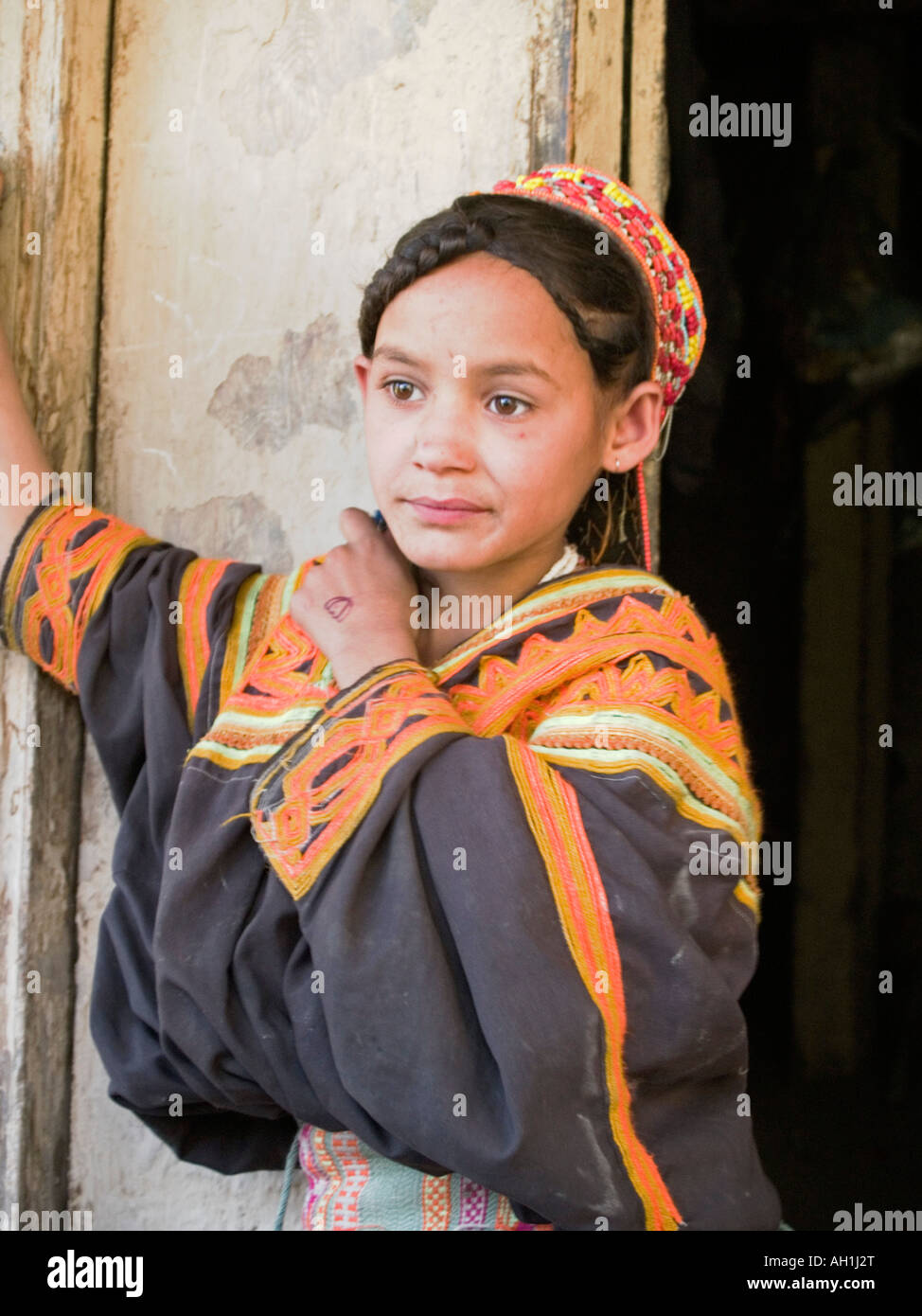 Kalasha girl in her doorway Rumbur Chitral, Pakistan Stock Photo - Alamy