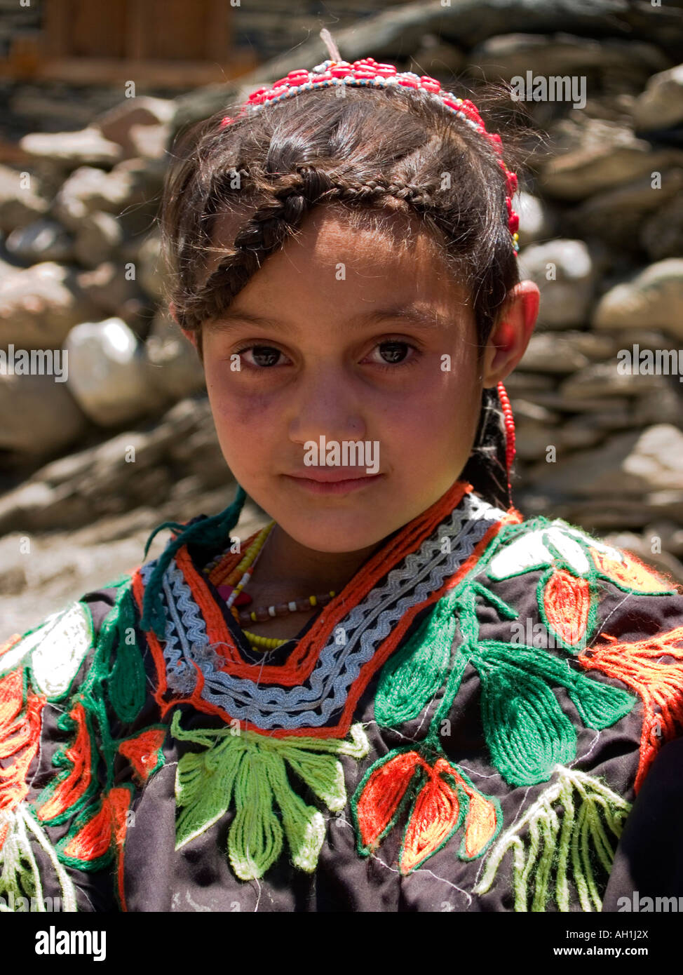 Kalasha girl with traditional braid and dress Rumbur Valley, Chitral ...