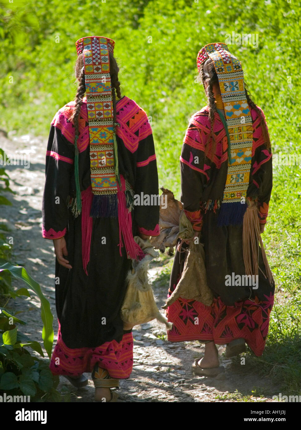 the traditional and colorful clothes worn by Kalasha women Stock Photo ...