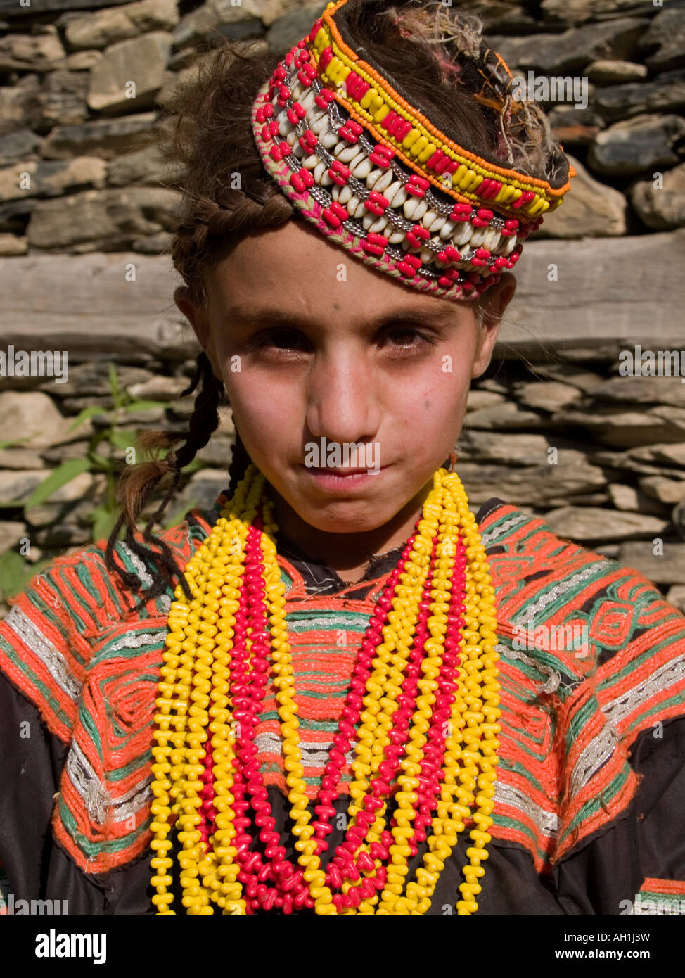 A feisty young Kalasha girl posing Stock Photo - Alamy
