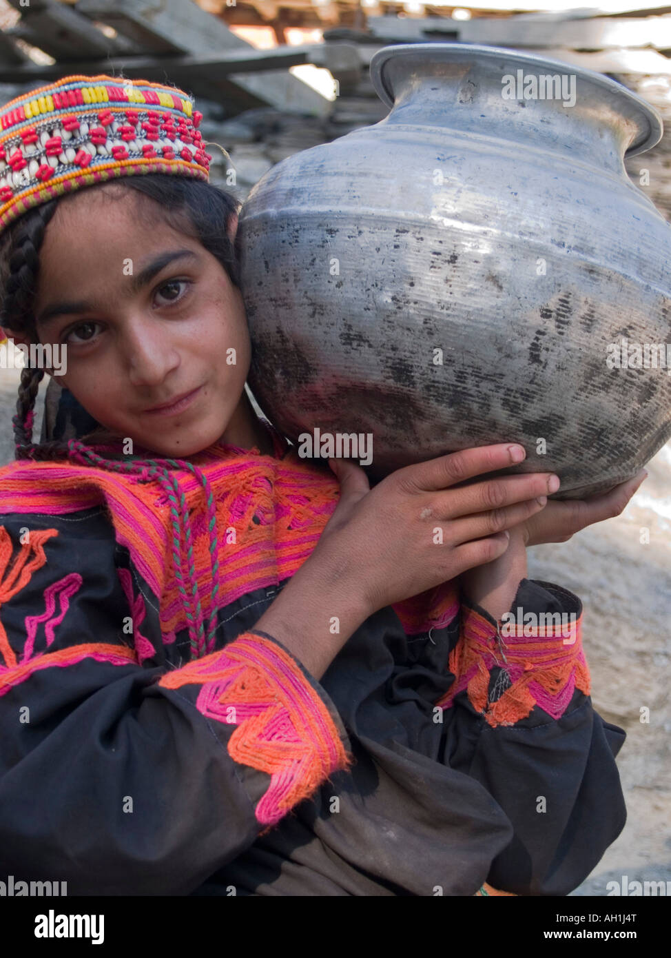 A Kalasha girl and her water jug Rumbur Valley Pakistan Stock Photo - Alamy