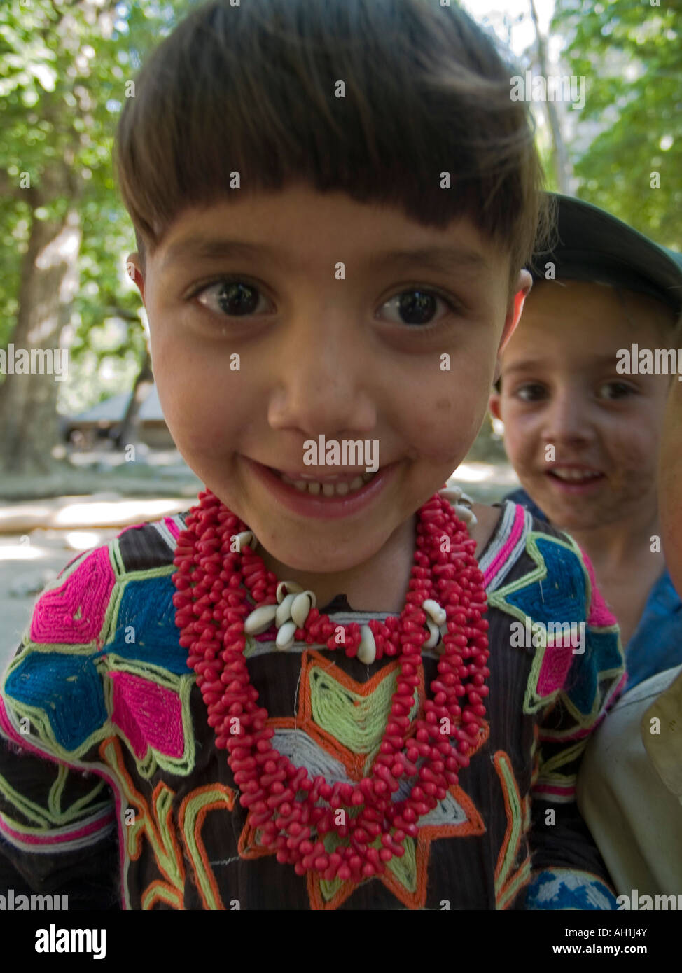 little Kalasha girl smiling, Chitral, Pakistan Stock Photo - Alamy