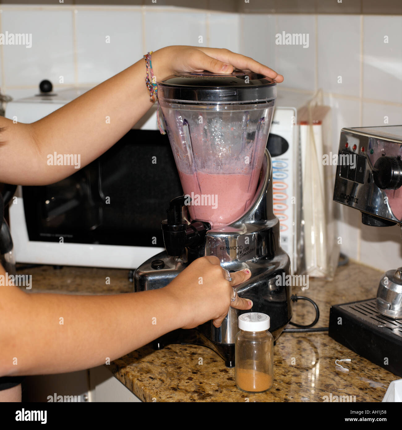 Making Strawberry Smoothie in Blender Stock Photo - Alamy