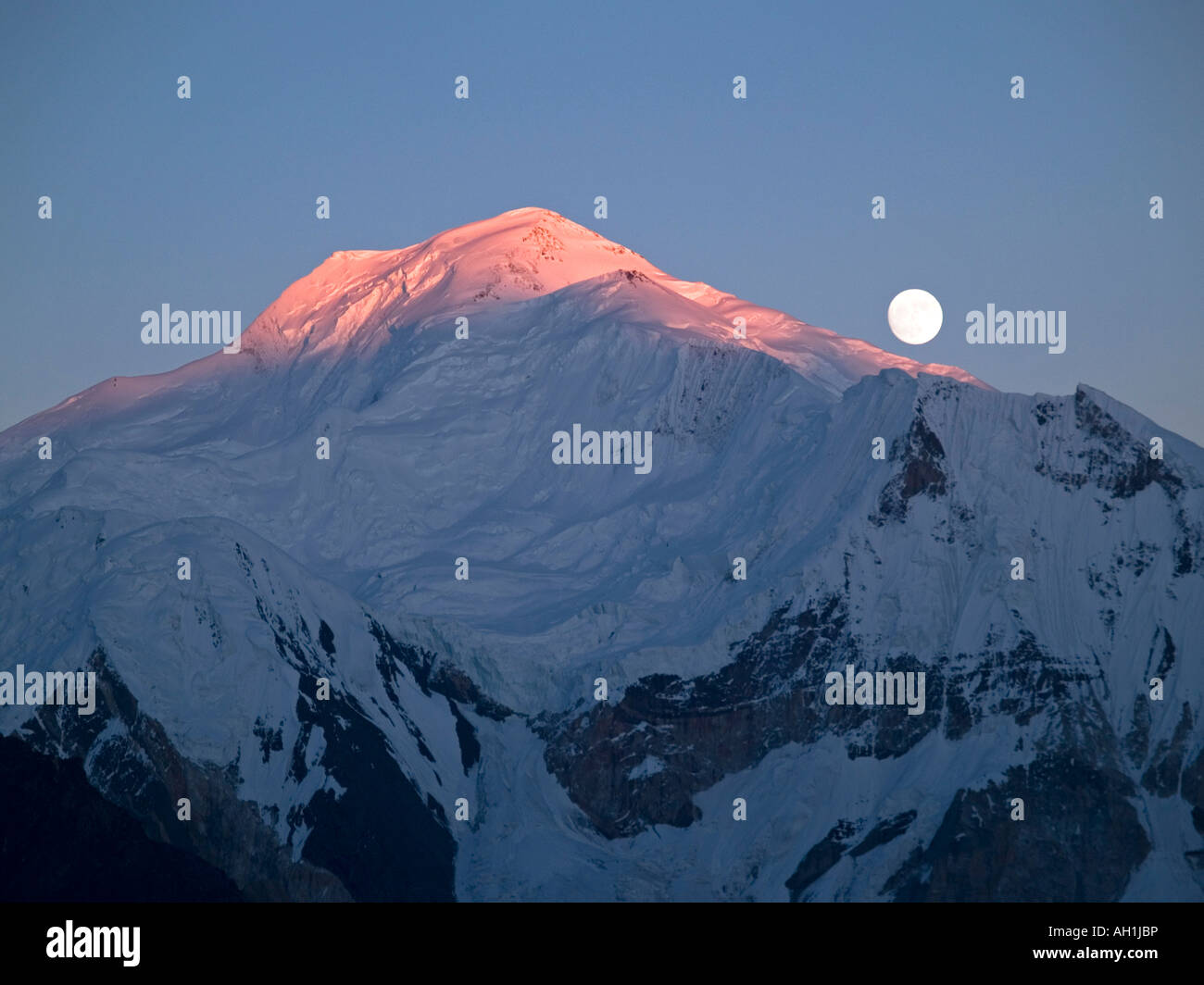 alpenglow and full moonrise in the Karakorams on Baltoro Kangri Peak ...