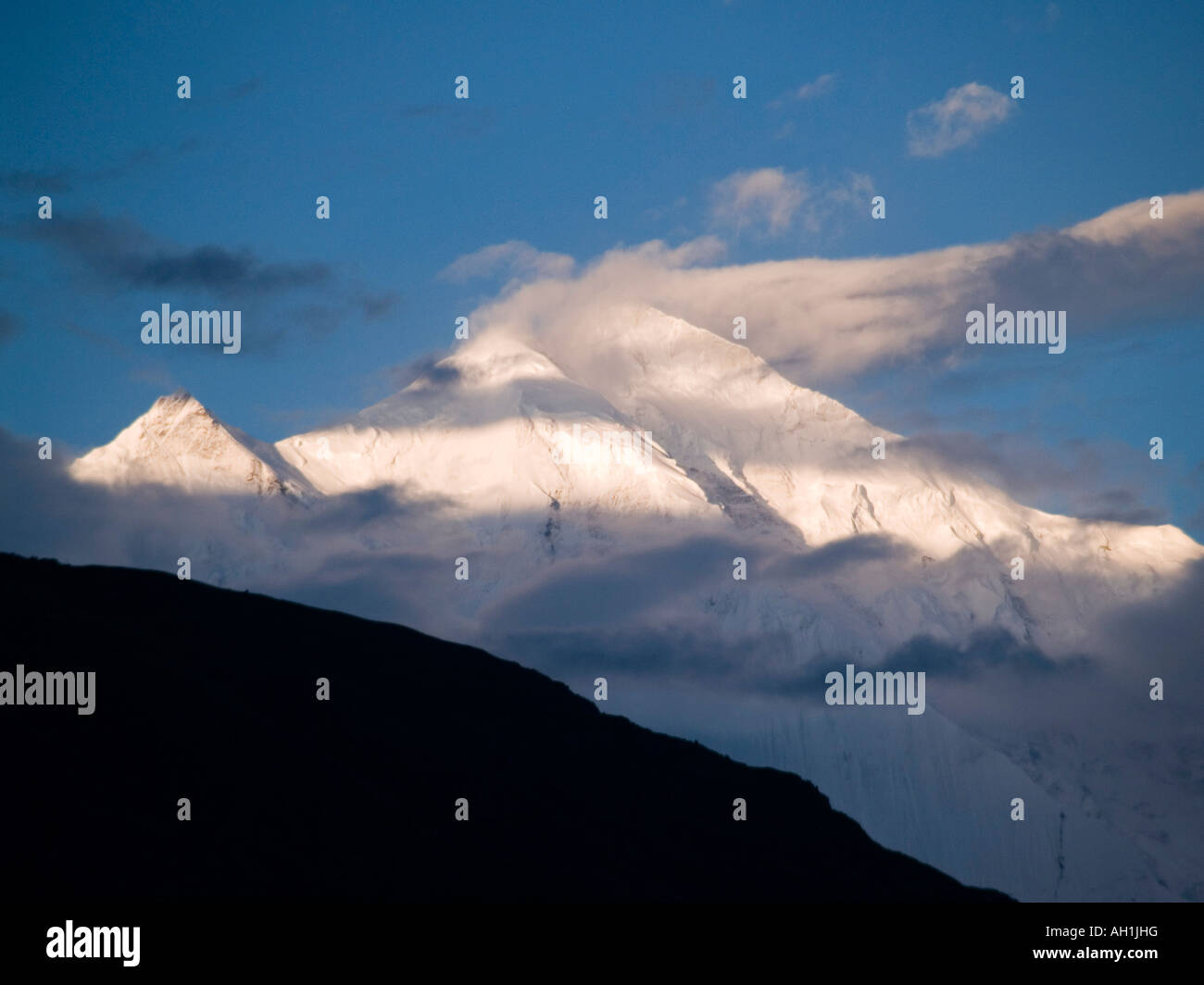 dawn on Rakaposhi Peak in the Hunza Valley Karakoram Range of northern ...