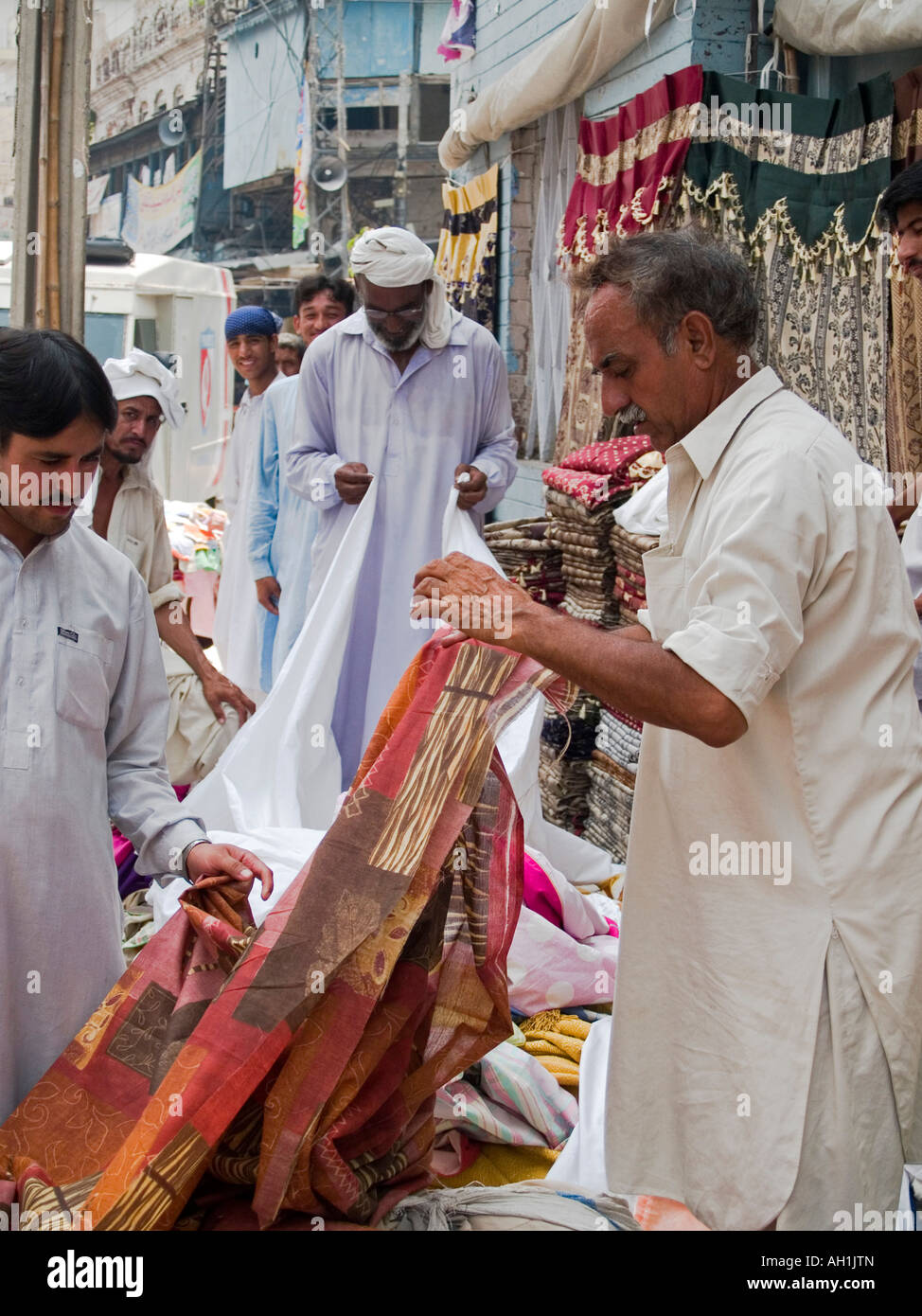 cloth merchant in the bazaars of Rawalpindi Pakistan Stock Photo - Alamy
