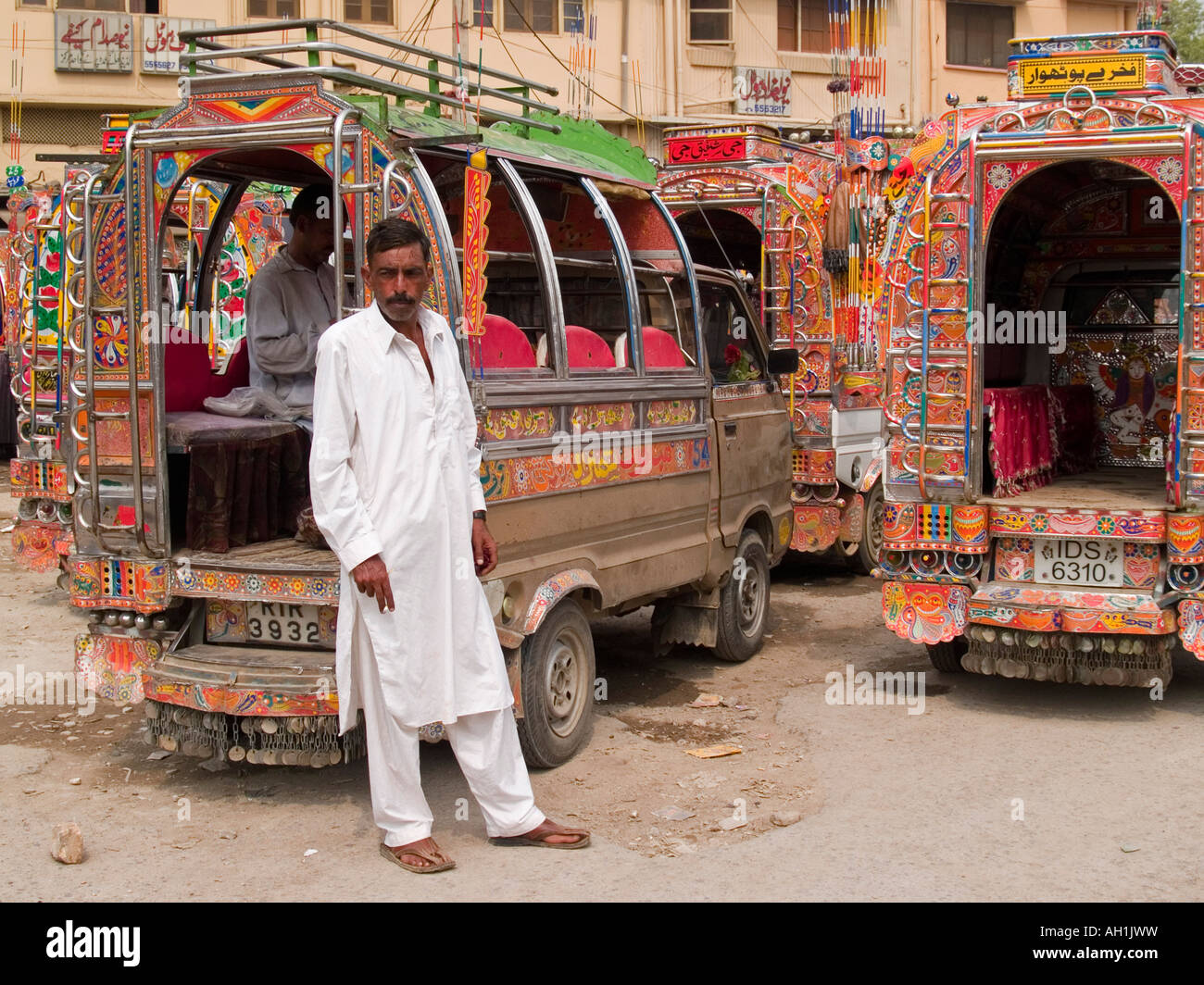 colorful Suzuki van used as public transport in the bazaar of ...