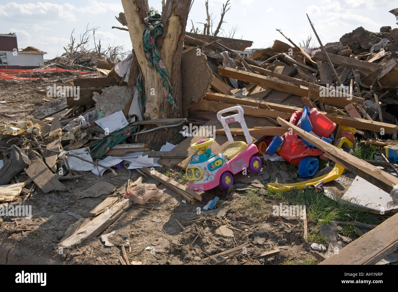 Childrens toys lie among the debris and tornado damage in Greensburg ...