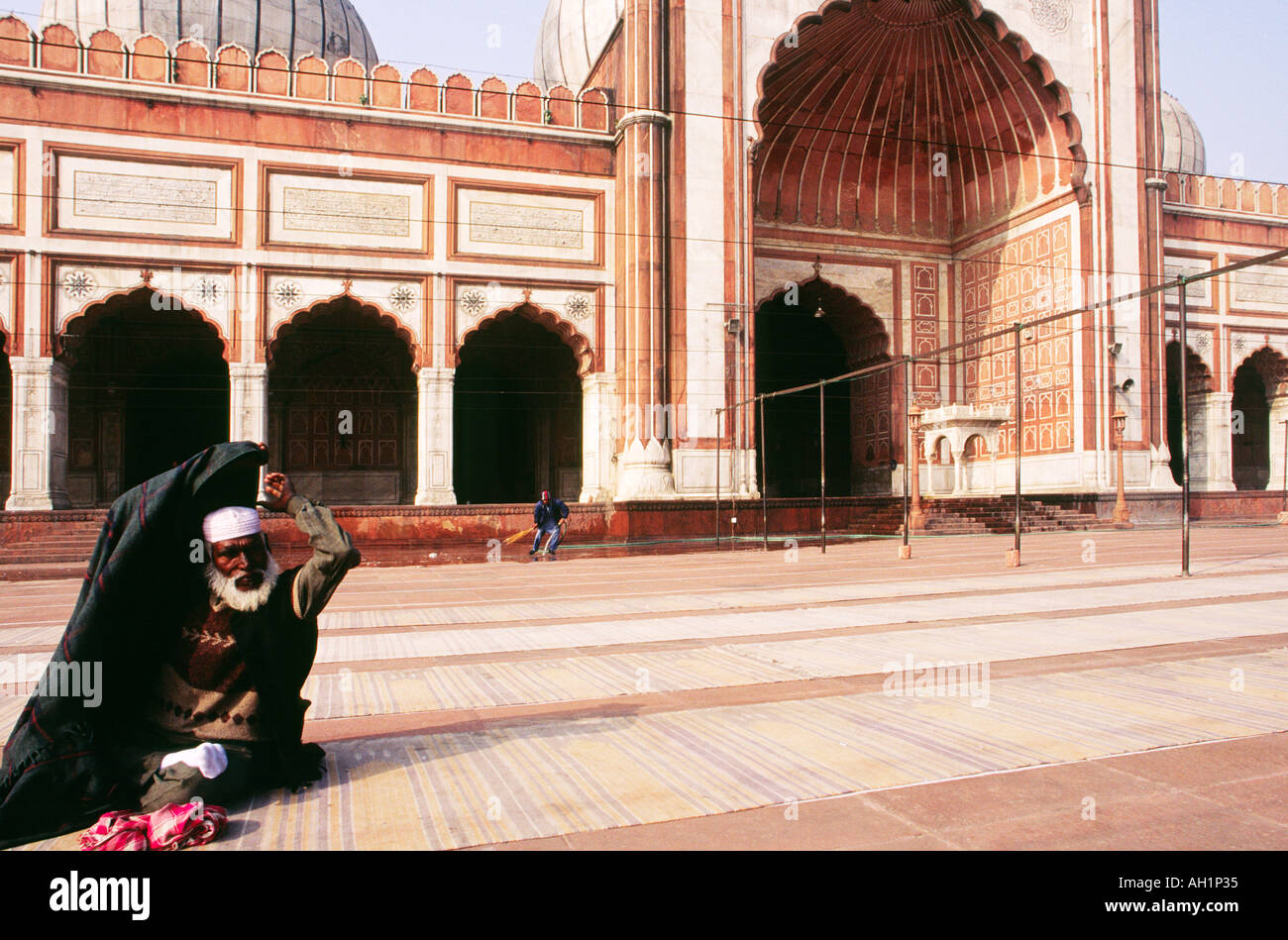 Jama Masjid Court one aged Muslim male sitting on carper praying New ...
