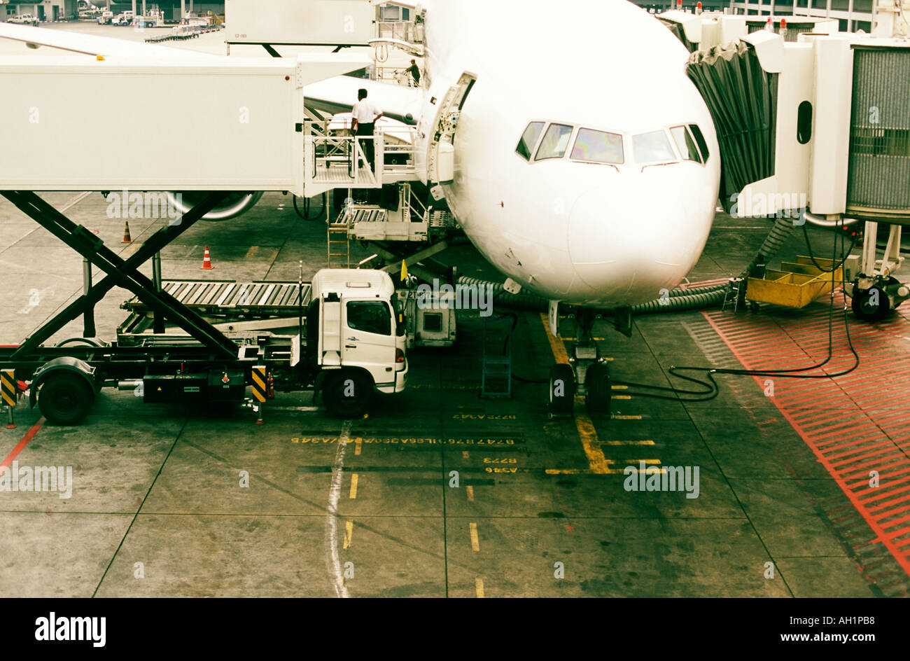 Busy international airport airplanes at the loading gates green blue ...