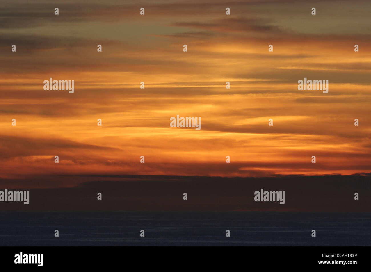 Sunset over ocean Stock Photo - Alamy