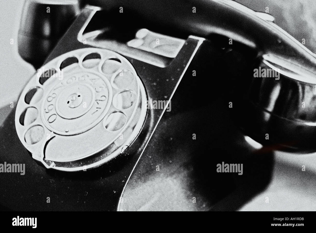 Old fashioned black rotary dial telephone Stock Photo - Alamy