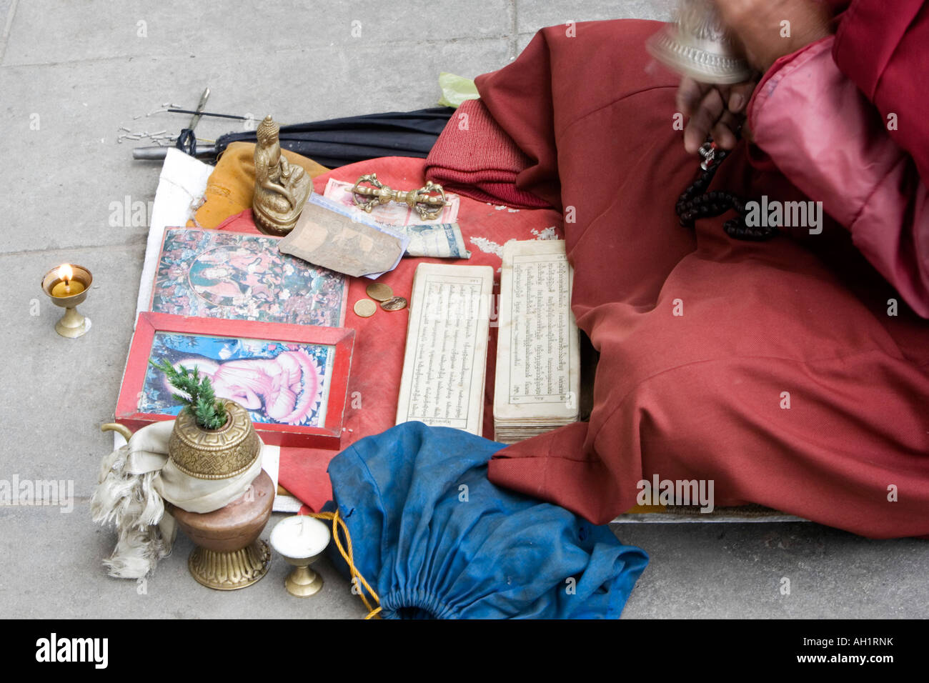 Tibetan buddhist monk ringing bell chanting on street outside Swayambhu ...