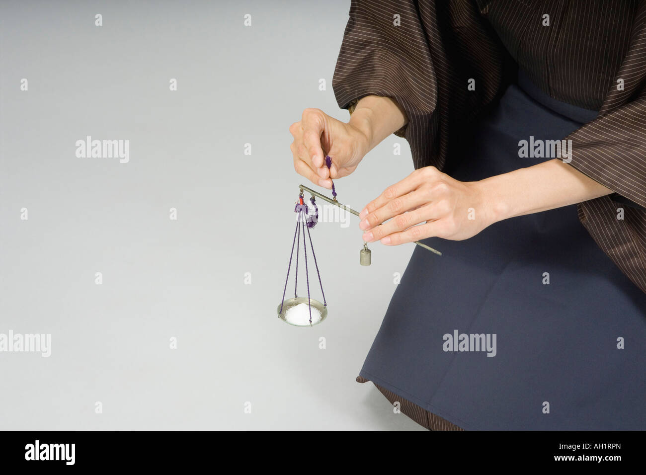 Man using balance scale Stock Photo - Alamy