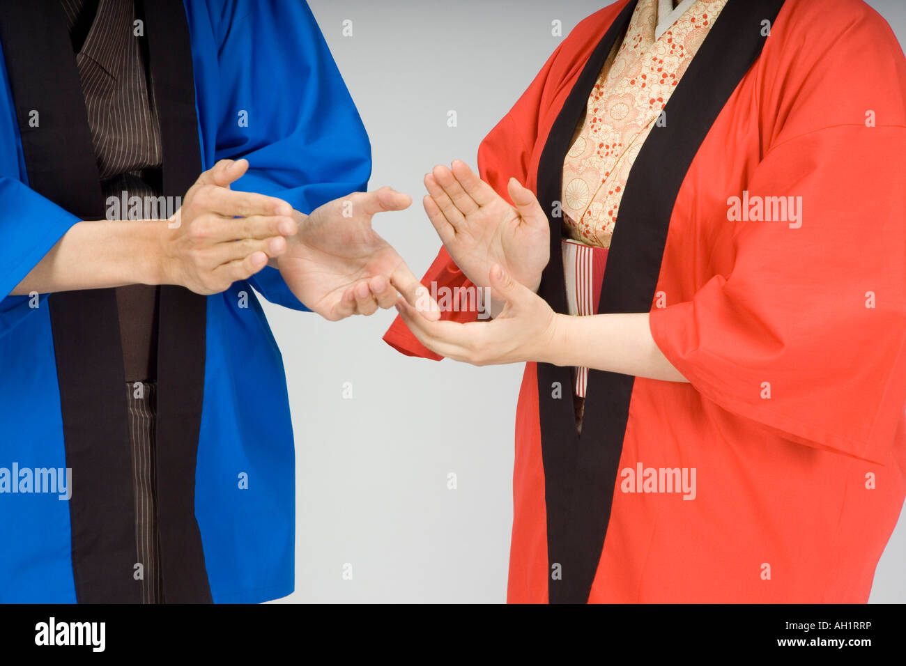 Man and woman clapping hands Stock Photo - Alamy