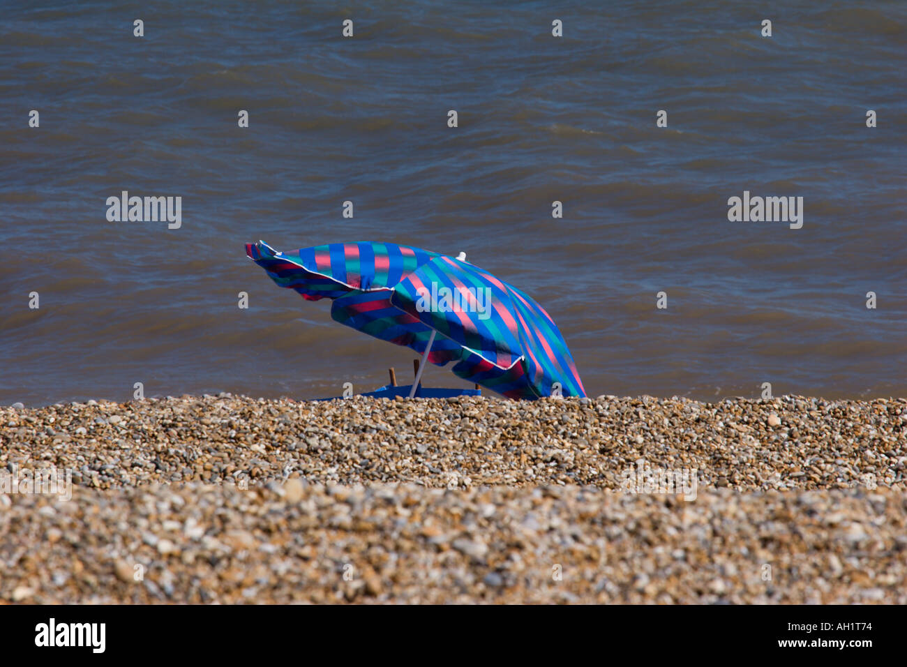A single umbrella on the beach at Aldeburgh in Suffolk Stock Photo - Alamy