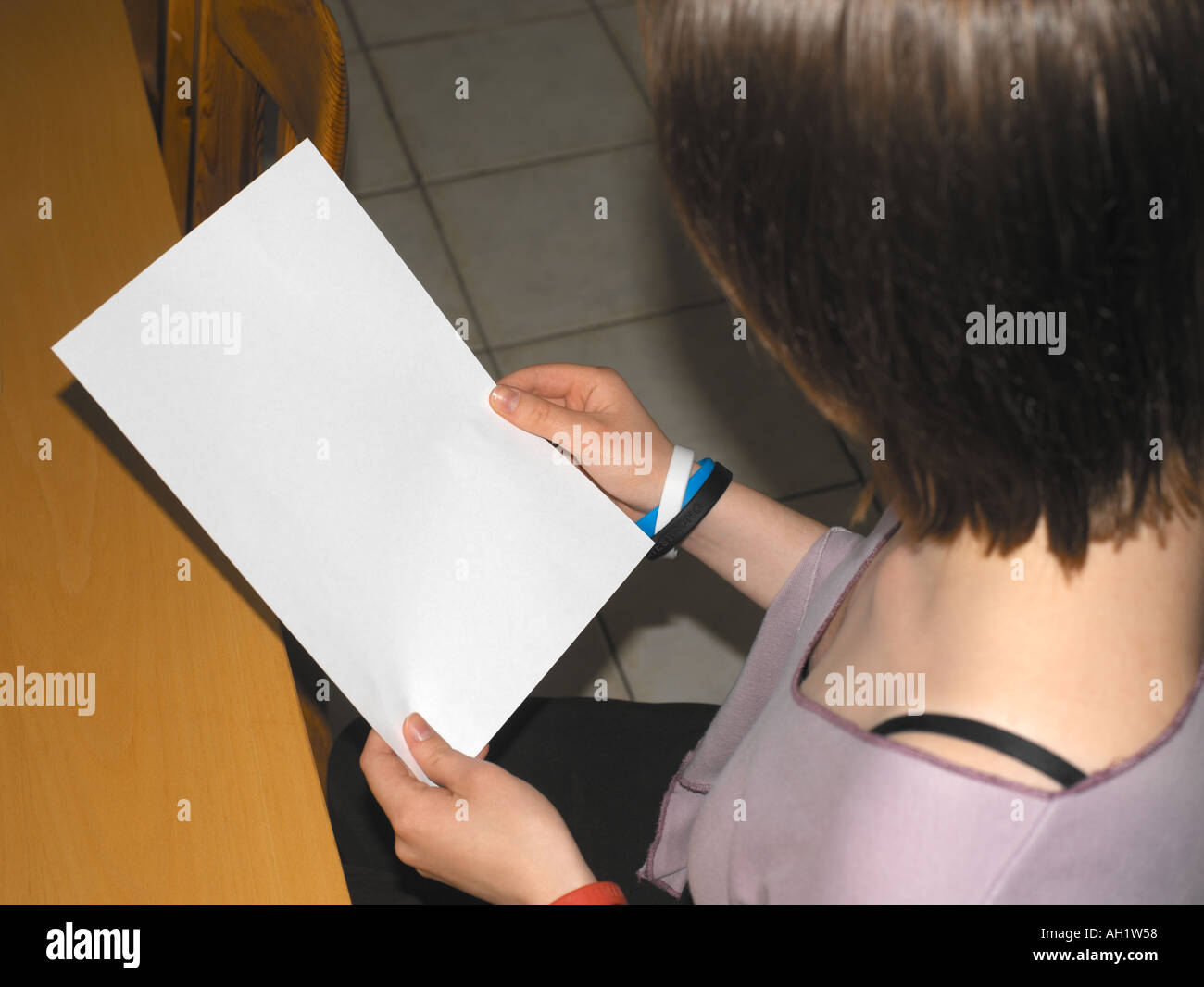 Woman Staring at a Blank Sheet of Paper Stock Photo - Alamy