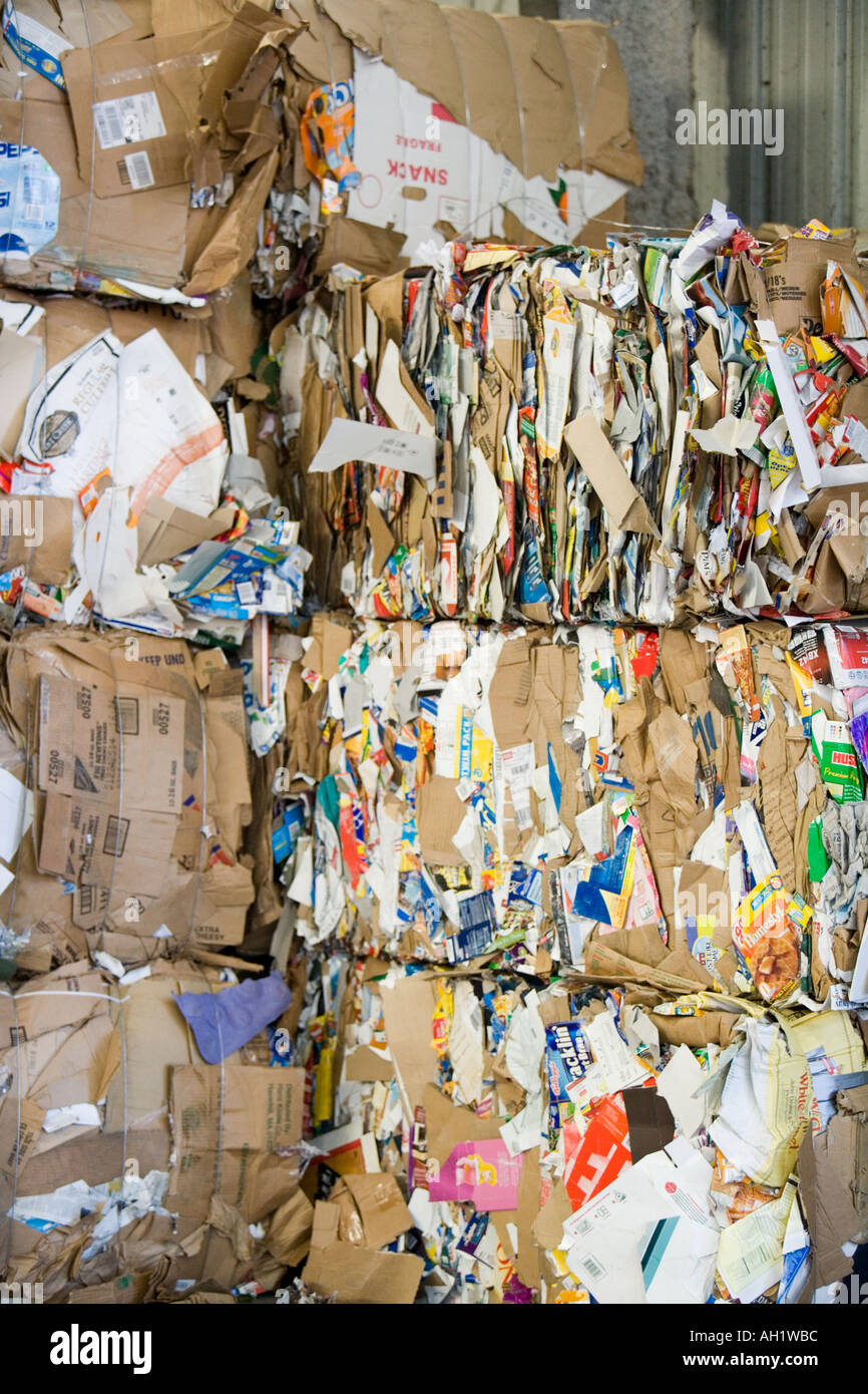 Recycled paper compacted and bundled at recycling facility Stock Photo ...