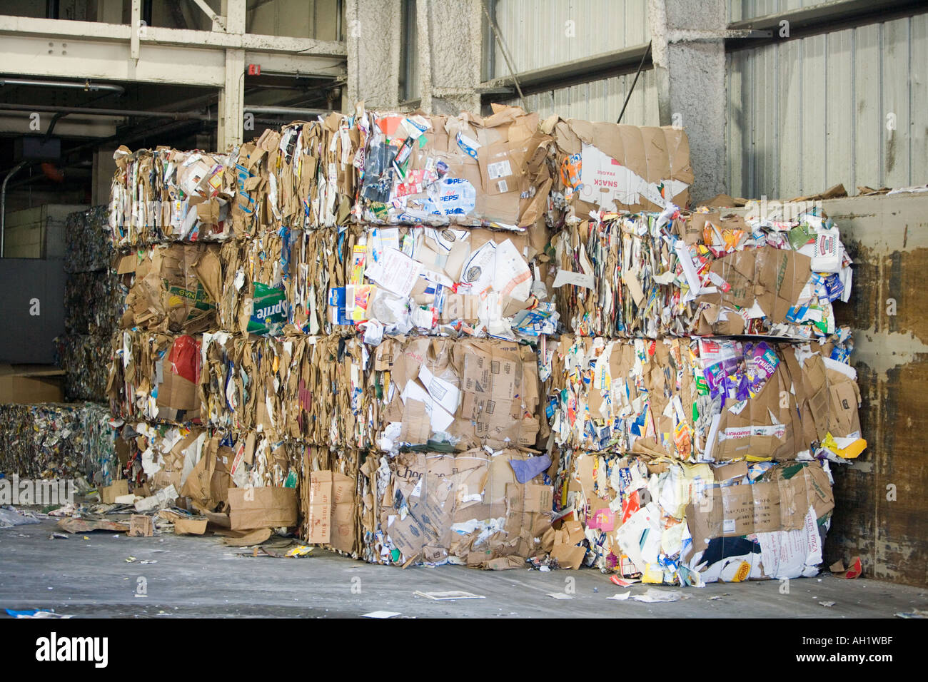 Recycled paper compacted and bundled at recycling facility Stock Photo ...