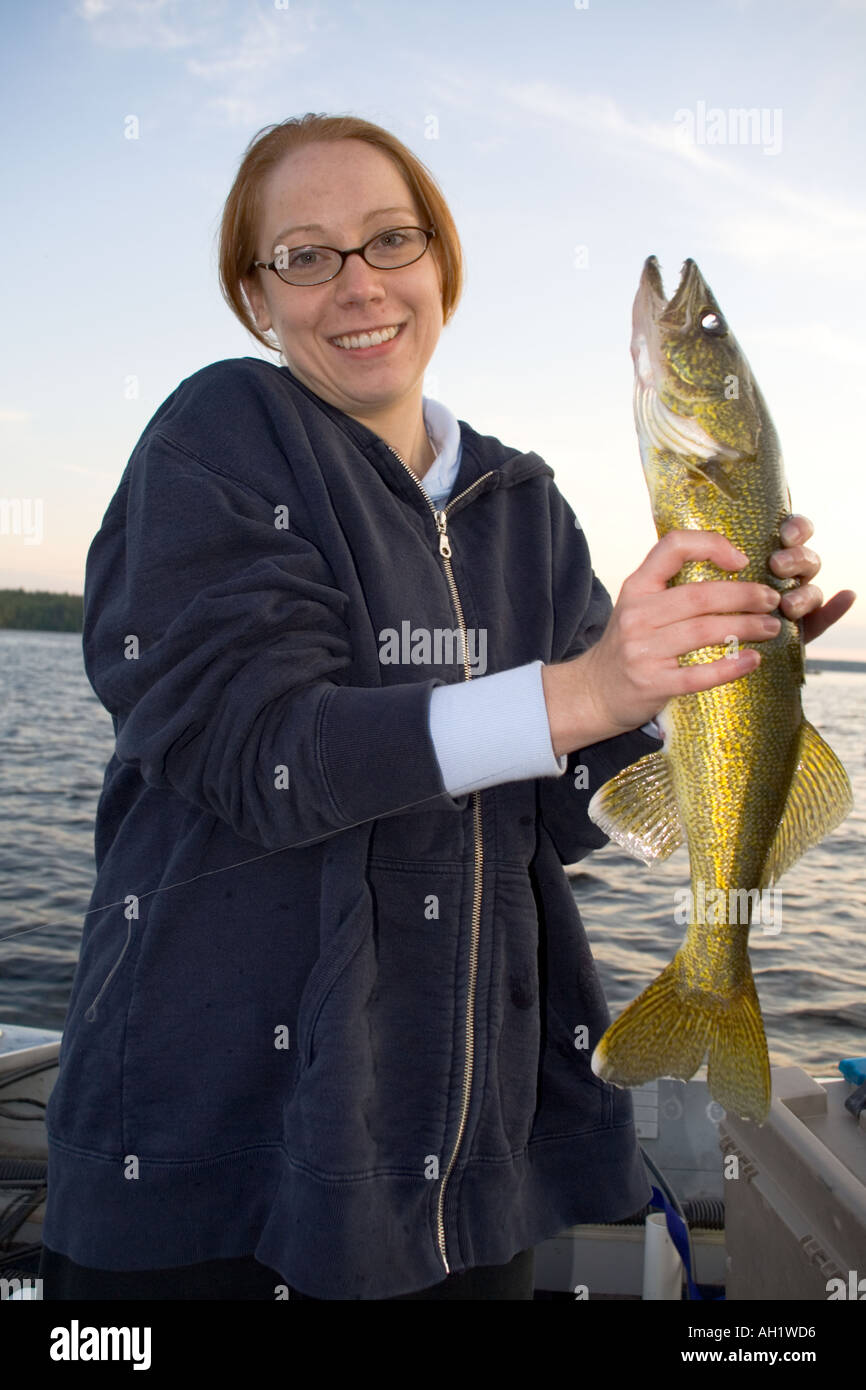 A lady holds up her catch in Alberta Canada Stock Photo - Alamy