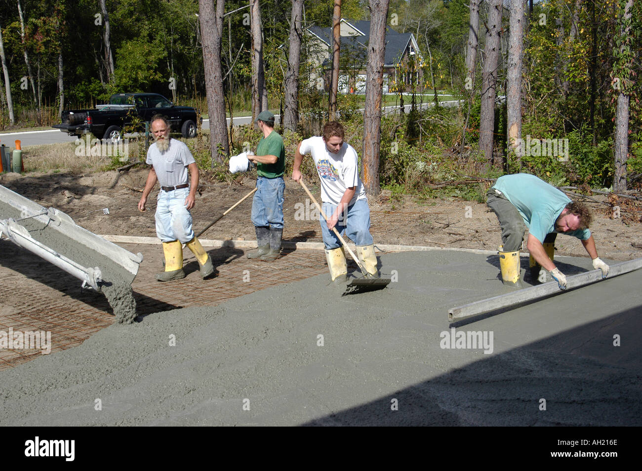 Cement Workers Finish Driveway Stock Photo - Alamy
