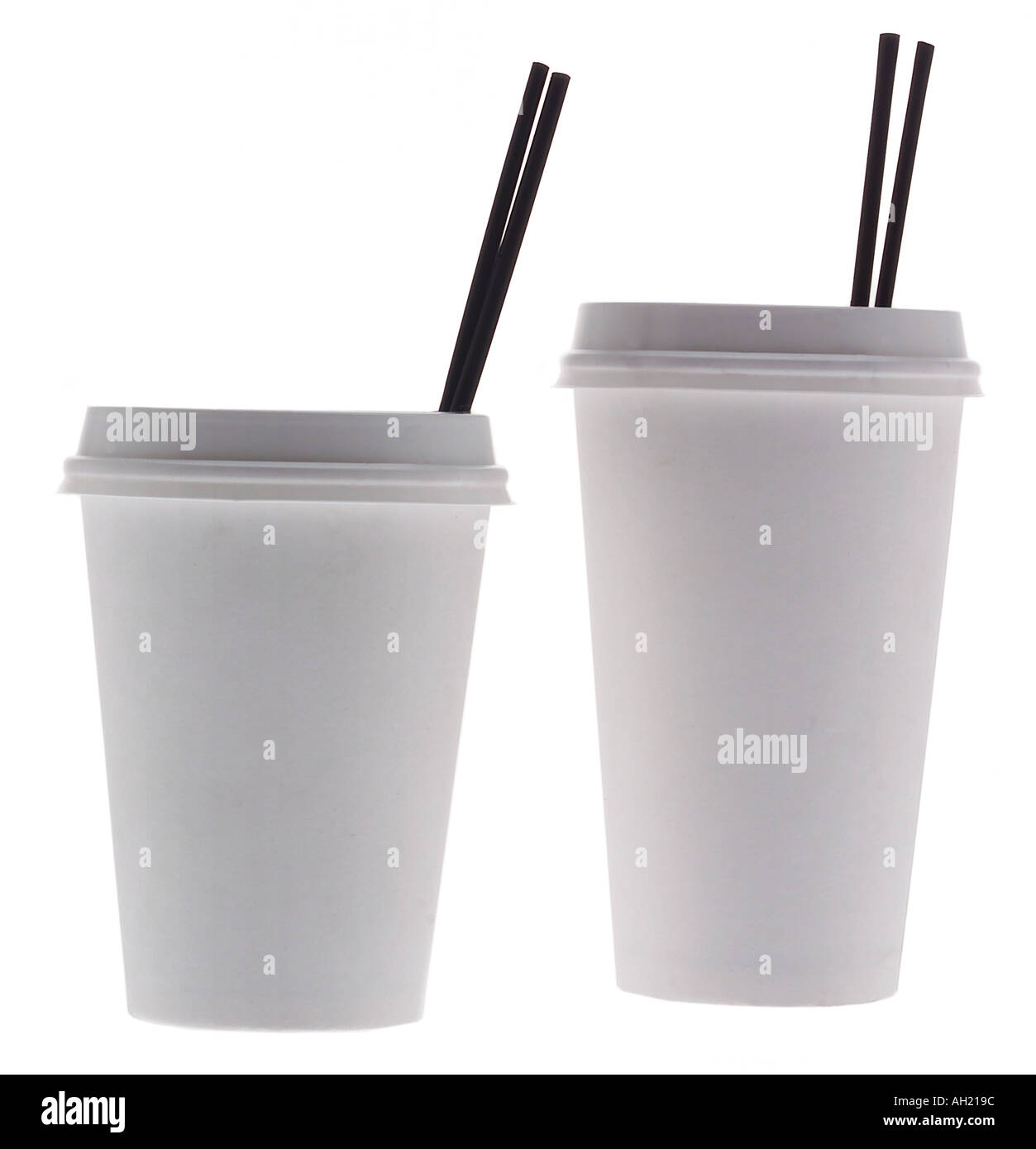 Two take-out cups with straws silhouetted on white background Stock ...