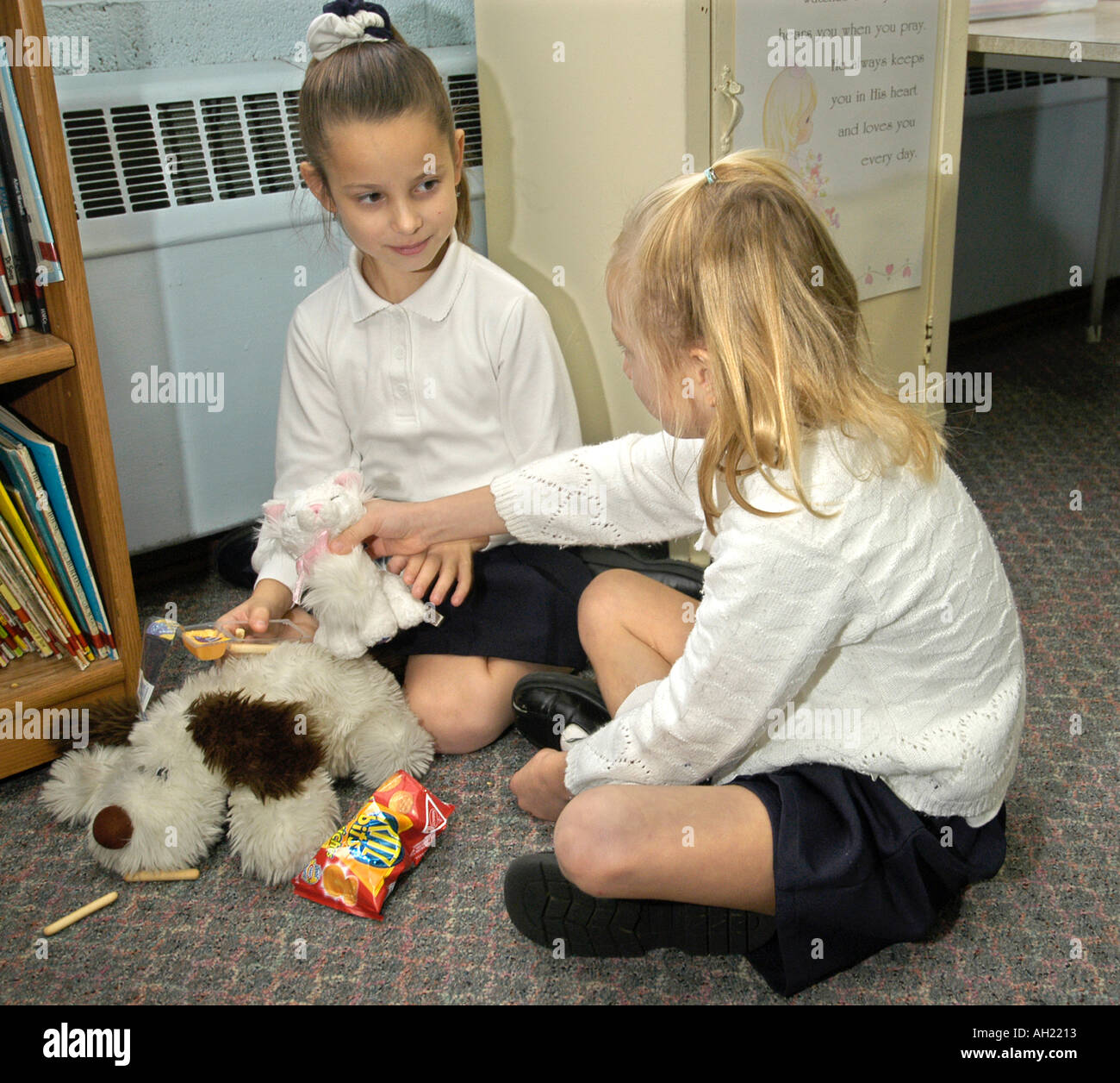 Girls work together on a project in an elementary school education ...