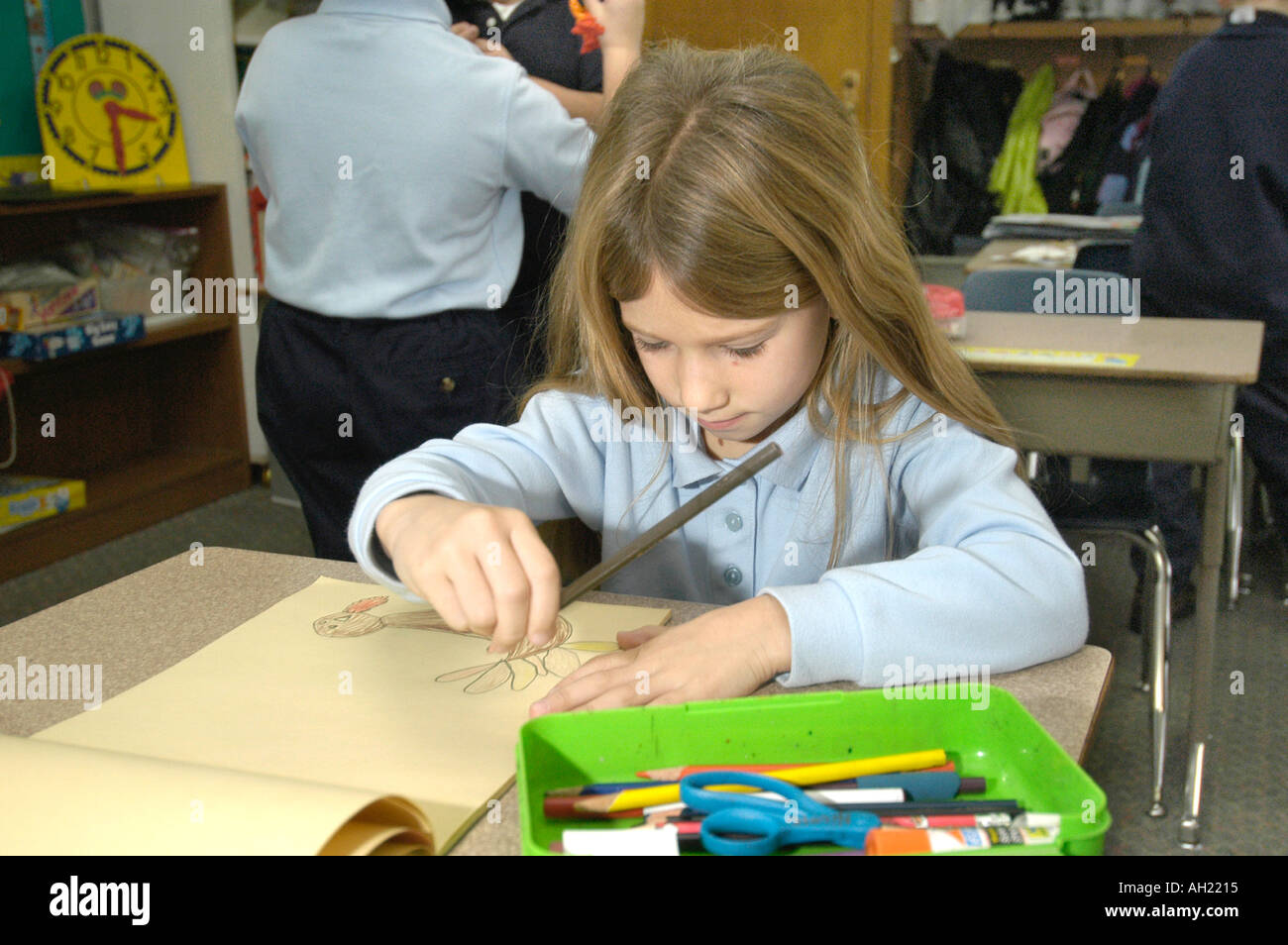 Child student working alone on a project at Elementary School Stock ...