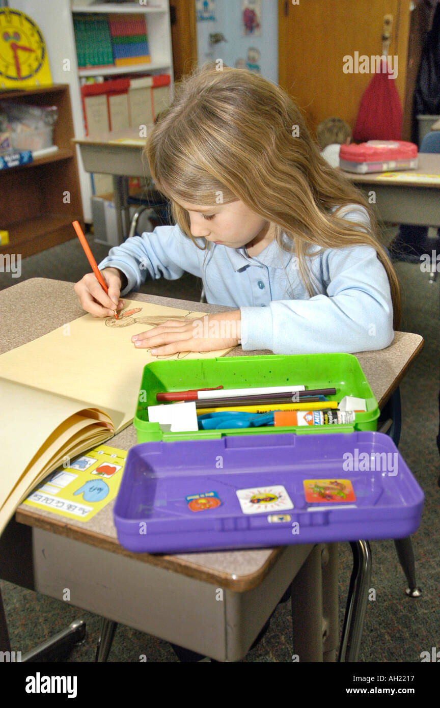 Child student working alone on a project at Elementary School Stock ...