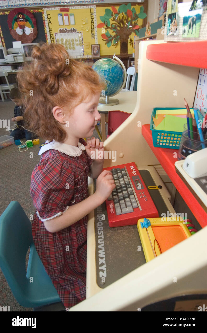Elementary school female girl play learning a keyboard computer Stock ...