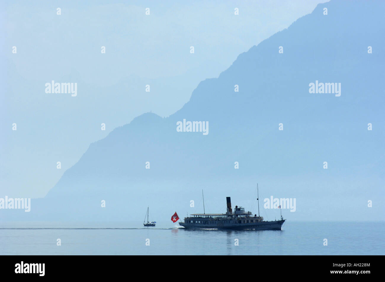 Lausanne paddle steamer, passenger boat, ferry, with mountains behind ...
