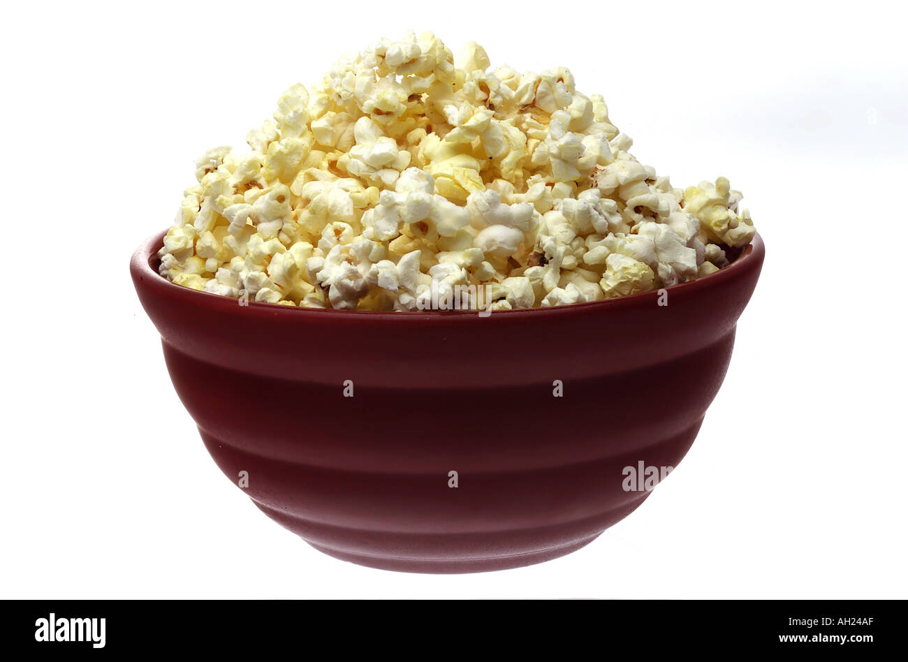 A big bowl of popcorn silhouetted on white background Stock Photo - Alamy