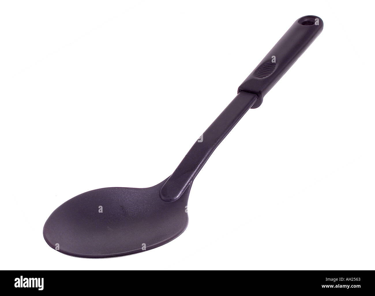 A black, plastic cooking spoon silhouetted on white background Stock ...
