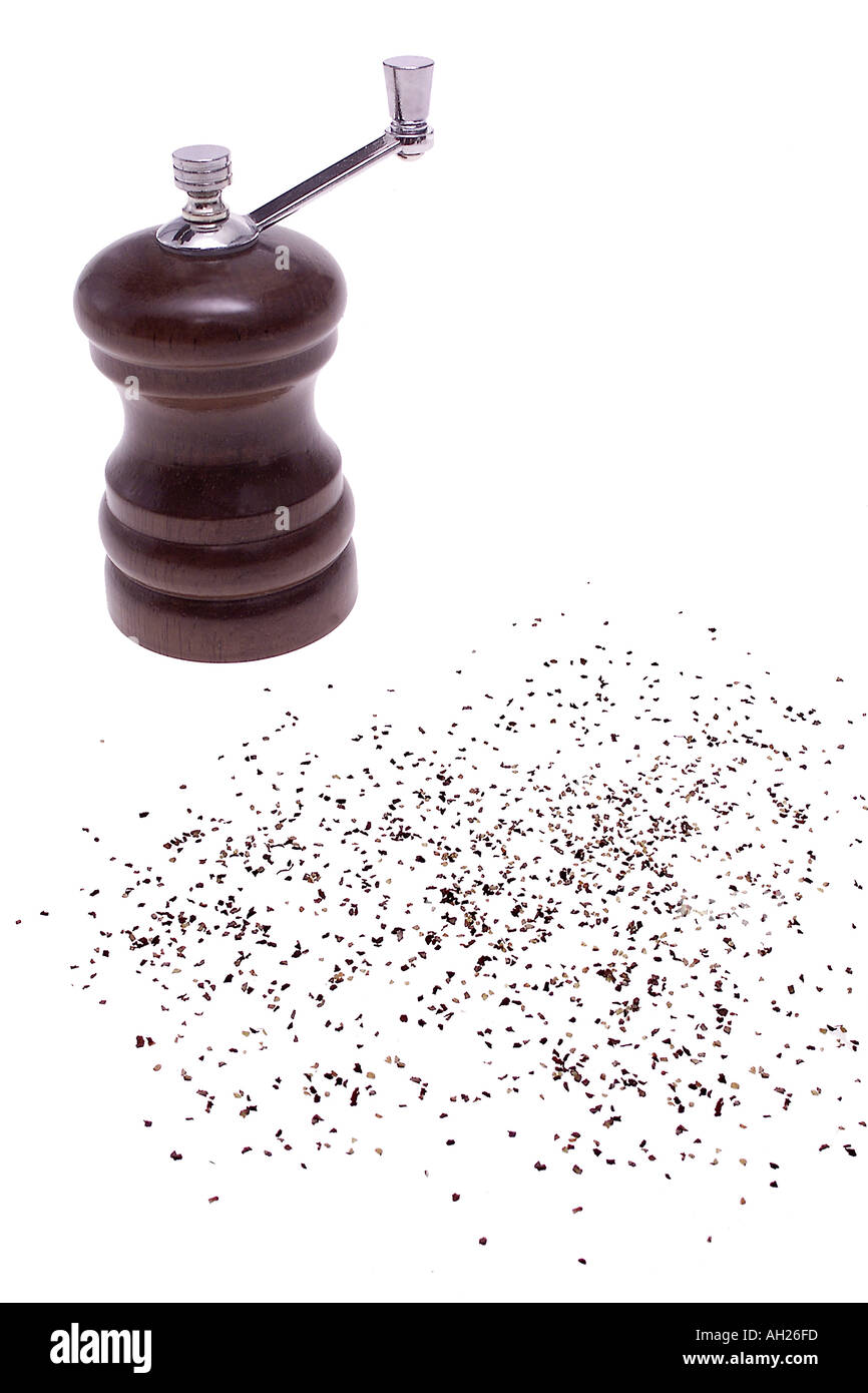 pepper mill and scattered pepper silhouetted on white background Stock ...