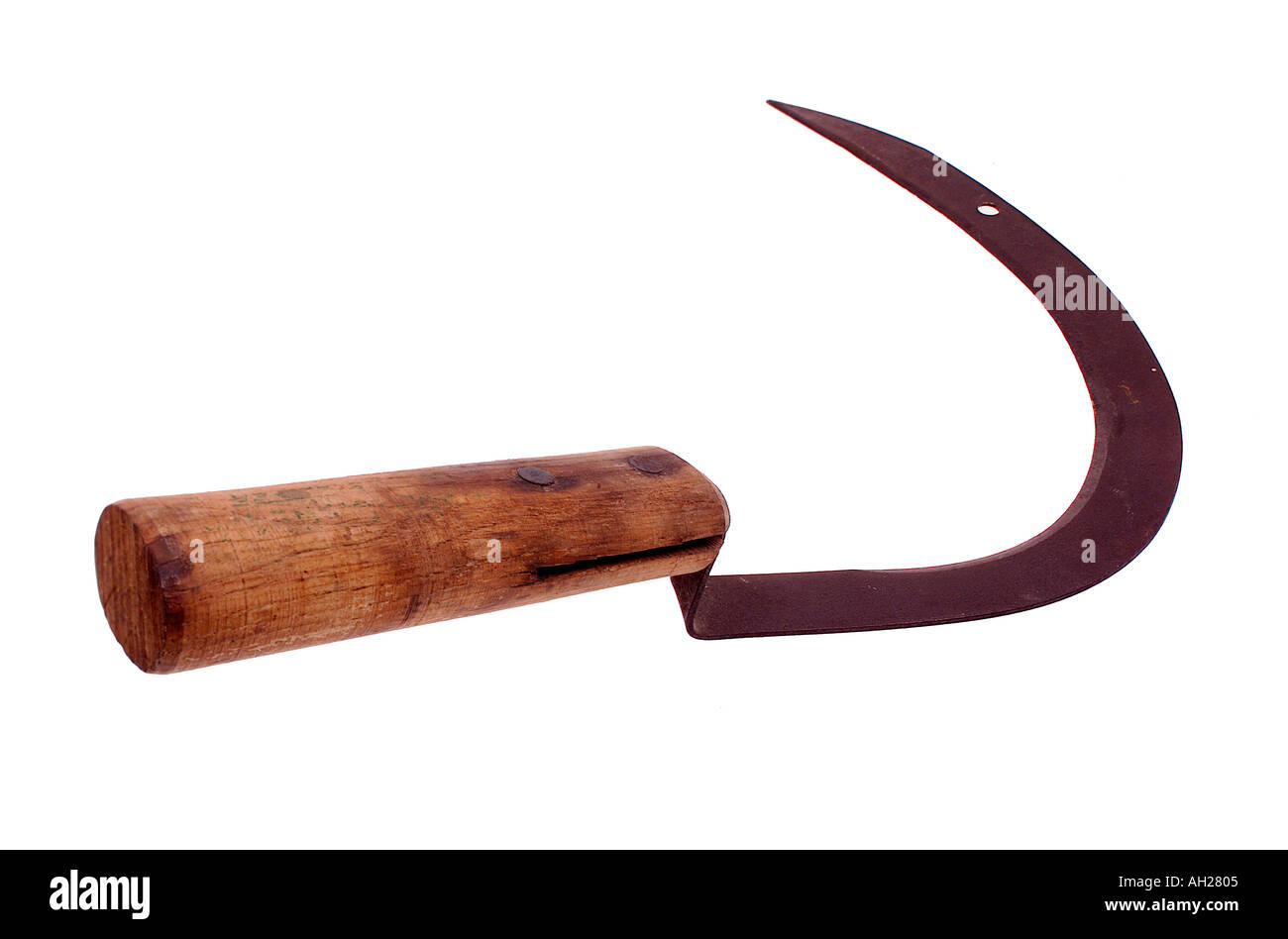 wooden handled hand sythe silhouetted on white background Stock Photo ...