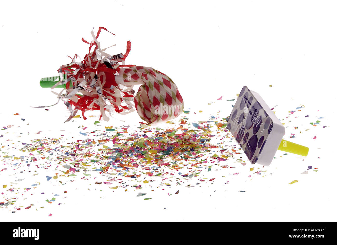 confetti and noise maker silhouetted on white background Stock Photo ...