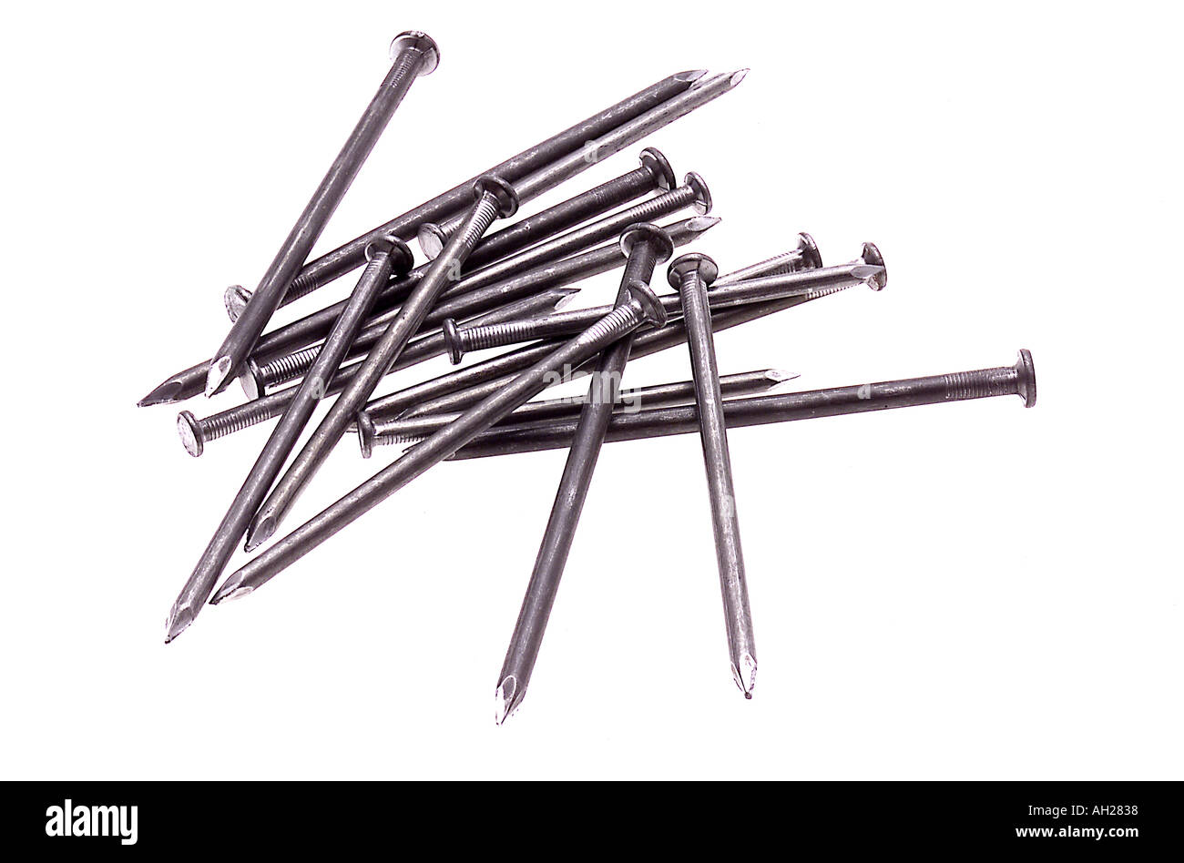 Silhouetted pile of wood nails on white background Stock Photo - Alamy