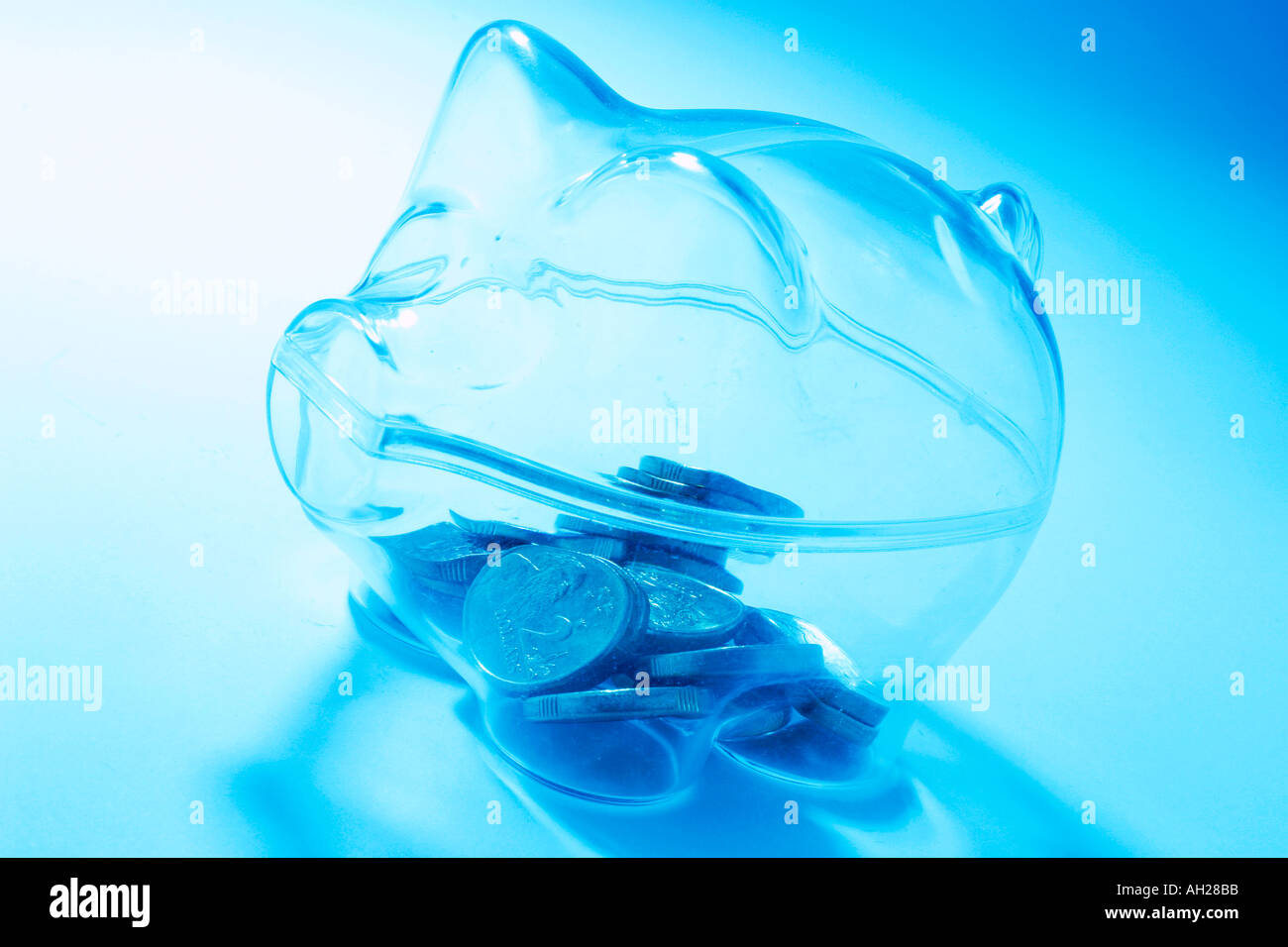 See-through Piggybank with Coins Stock Photo - Alamy
