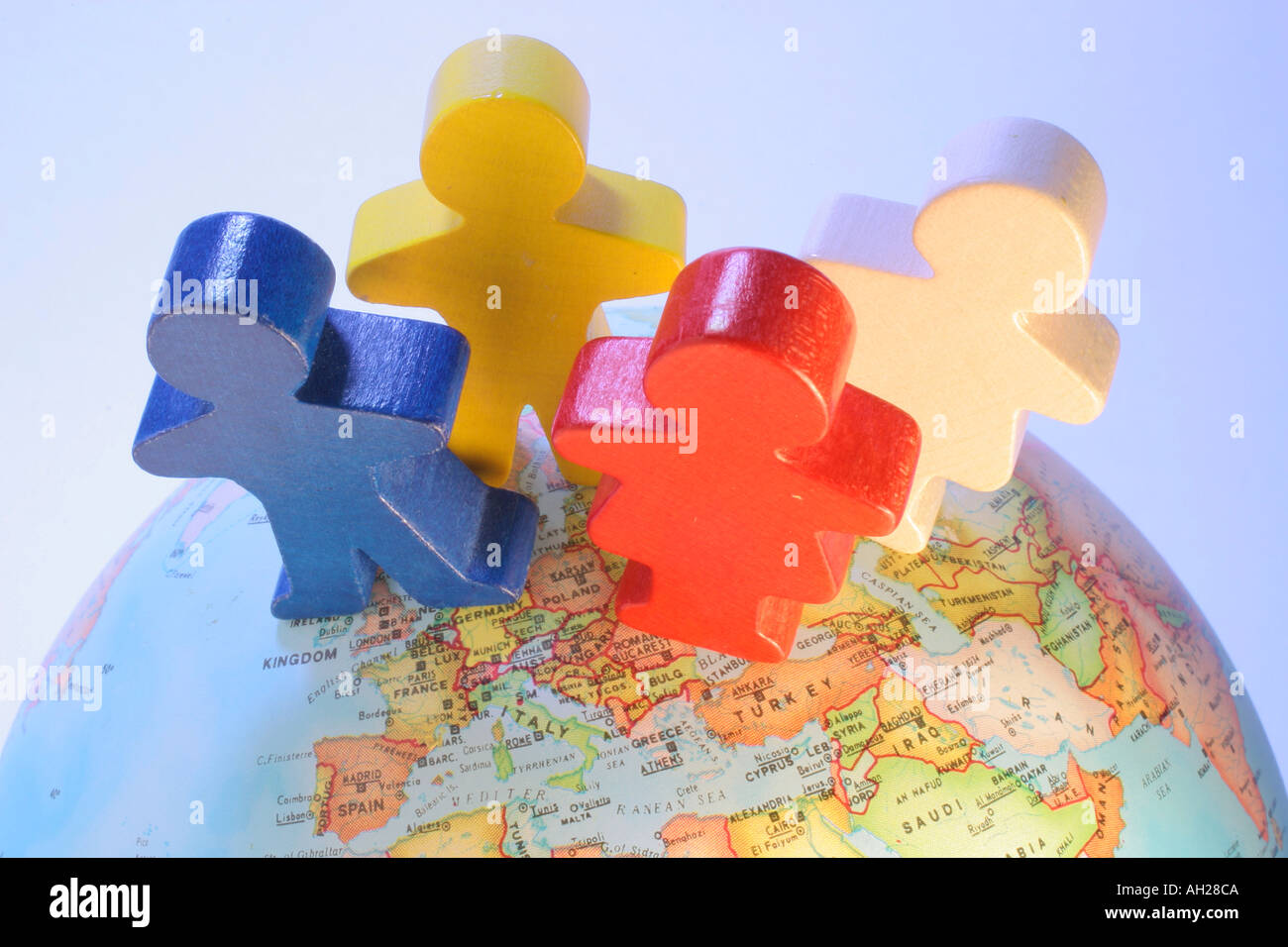 Wooden Children Figures on Globe Stock Photo - Alamy