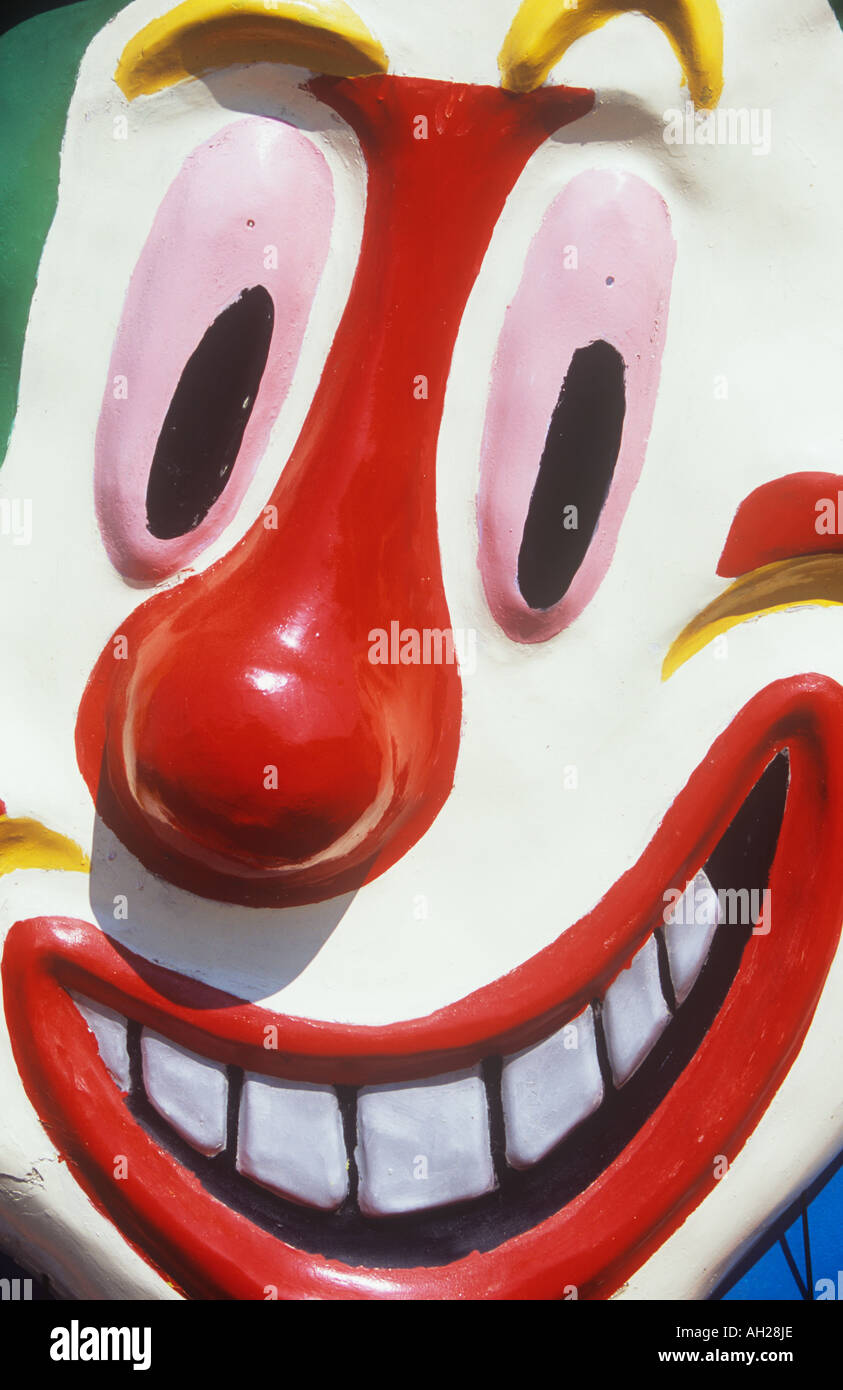 Detail of large model of clowns face with white and red makeup and ...