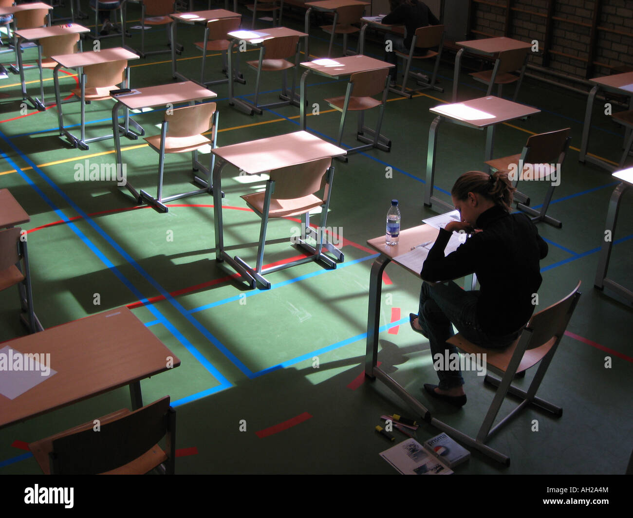 empty exam room with single candidate still working Stock Photo - Alamy
