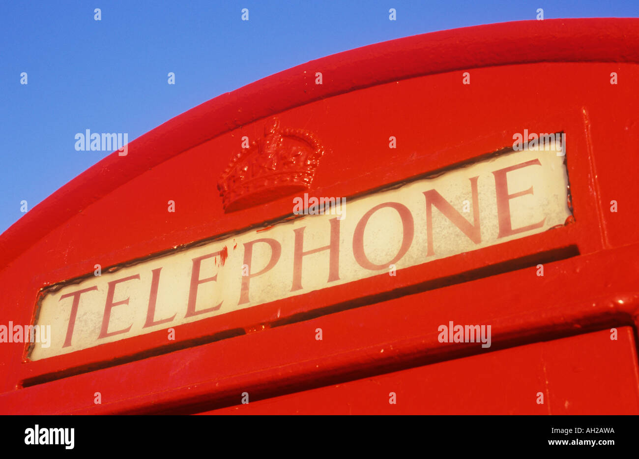Detail from below of curved roof of an old style UK red phone box with ...