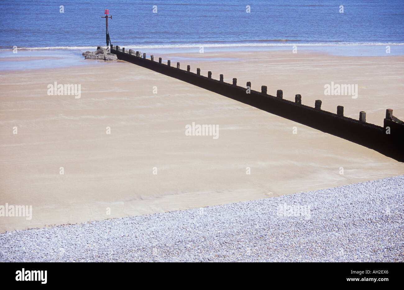 Sea defense rocks beach and sea and groin norfolk uk hi-res stock ...