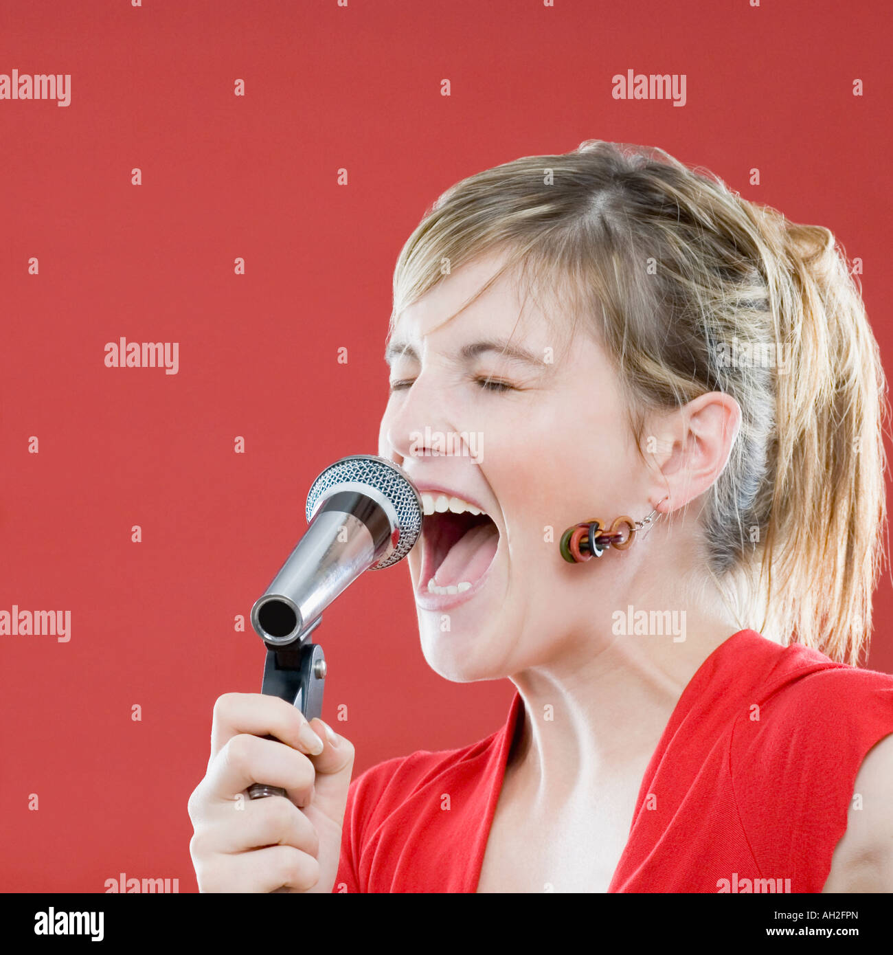 Hand holding microphone square hi-res stock photography and images - Alamy