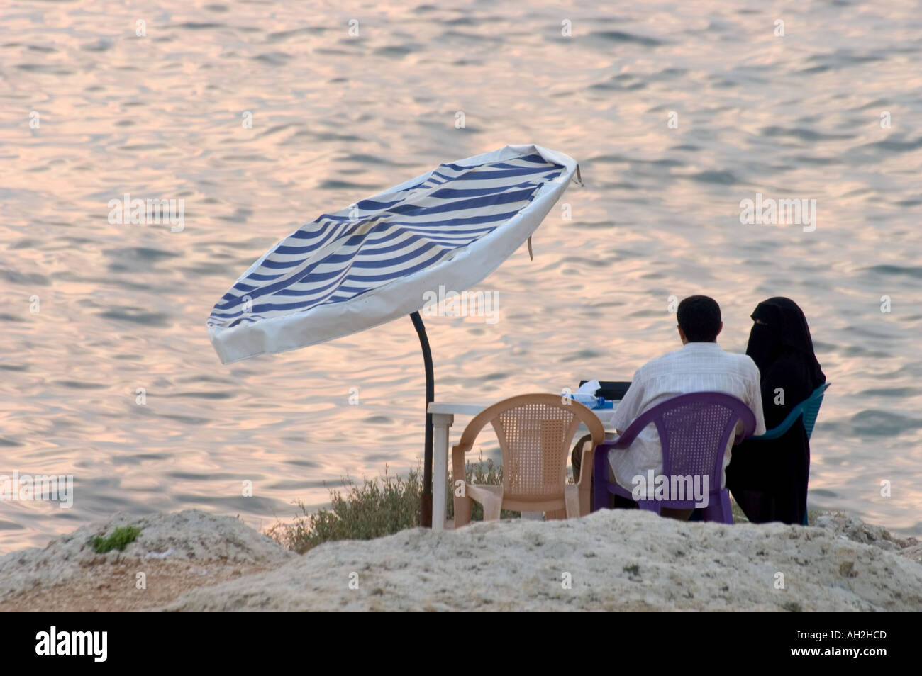people relaxing on rocks at beach Lattakia Syria Middle East Stock ...