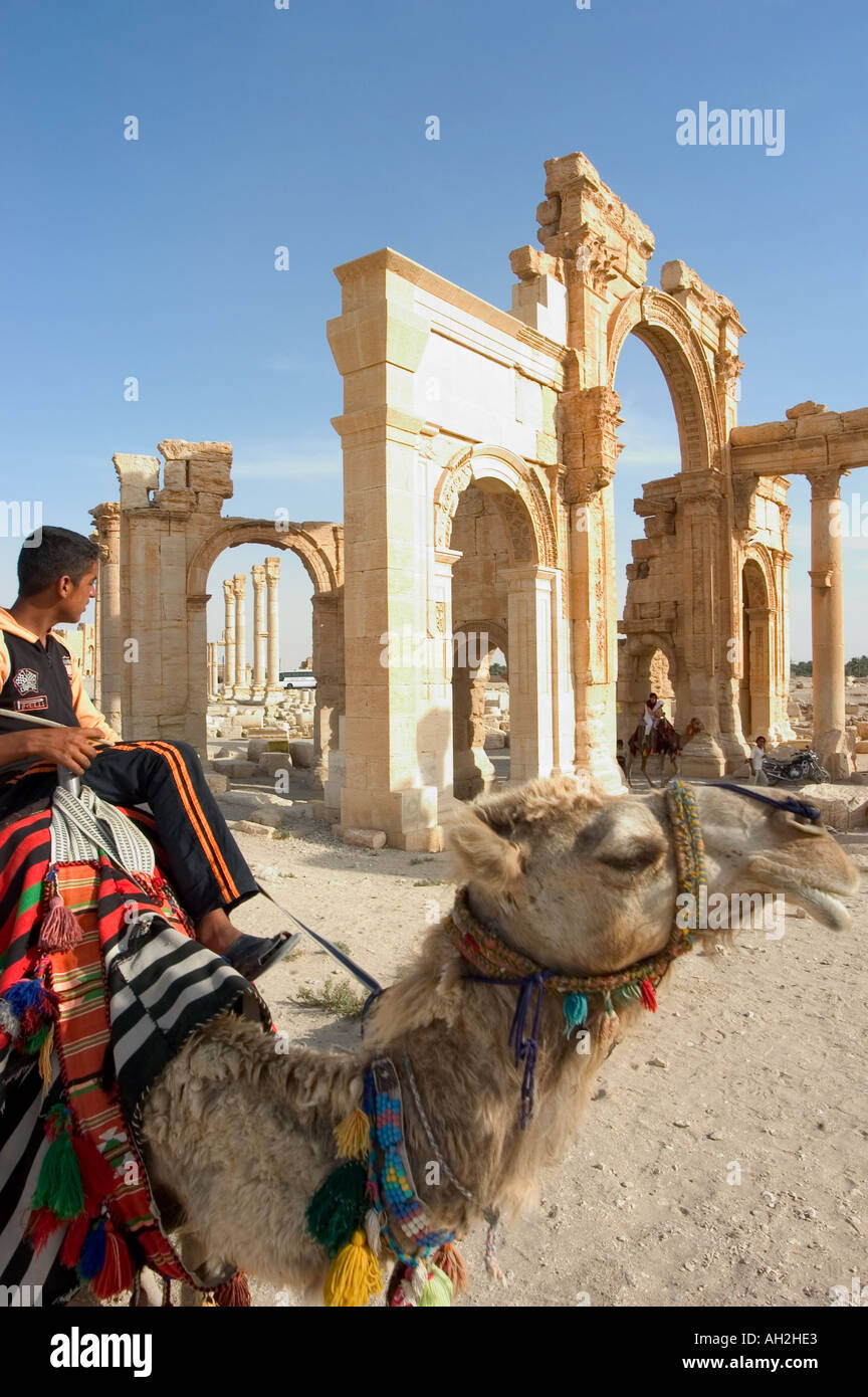 tourist camel ride monumental arch archaelogical ruins Palmyra Syria ...